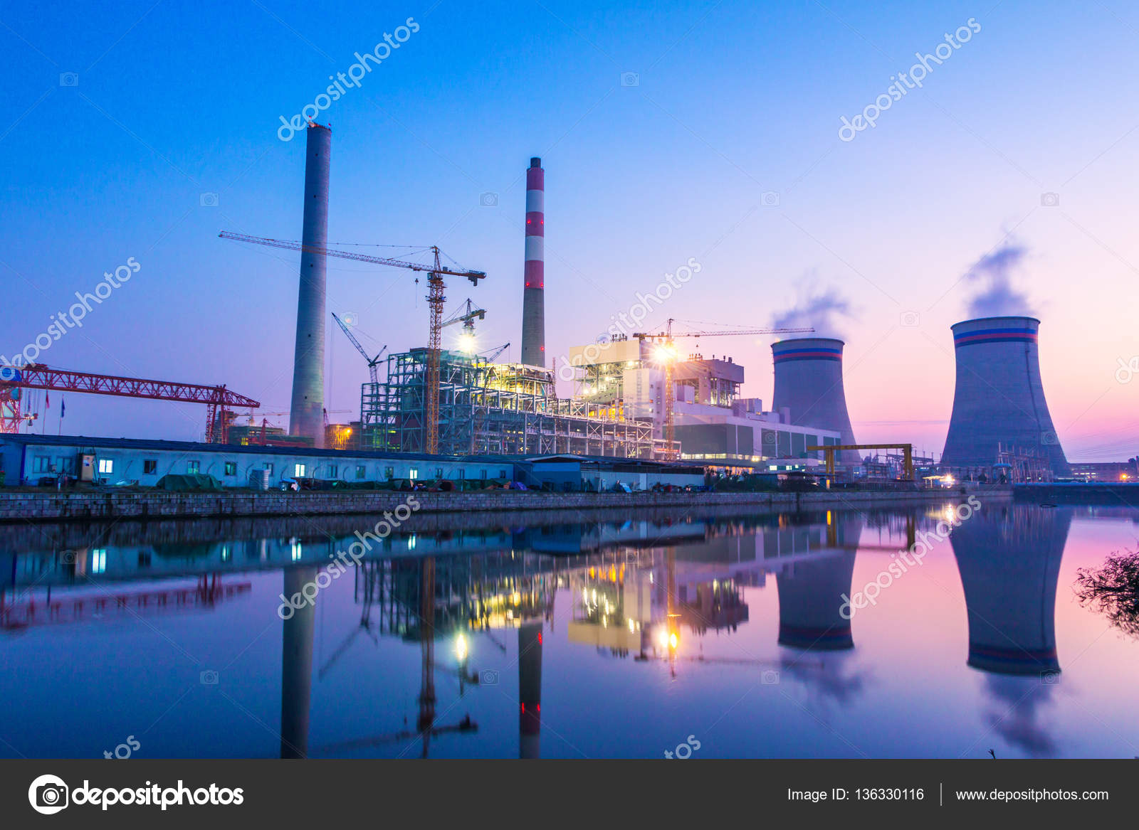 Modern waterfront power plant at sunset Stock Photo by ©zhudifeng 136330116