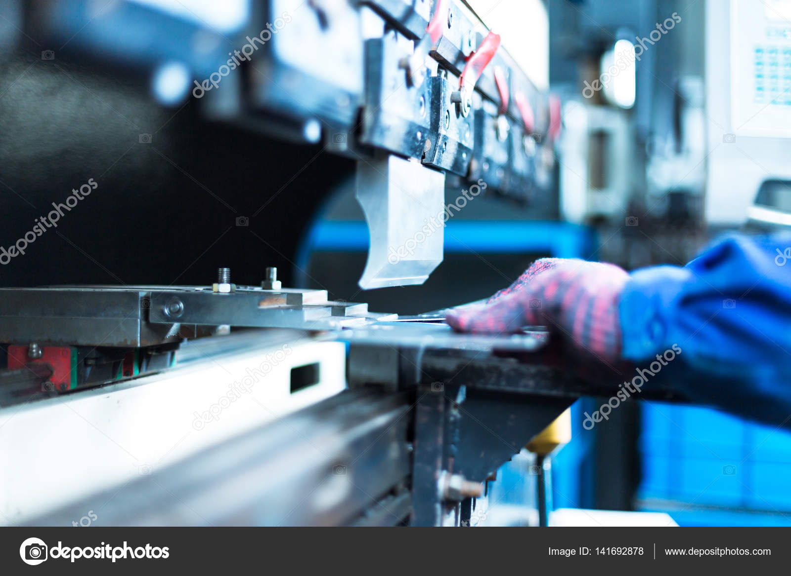 Person controls manufacturing machine Stock Photo by ©zhudifeng 141692878