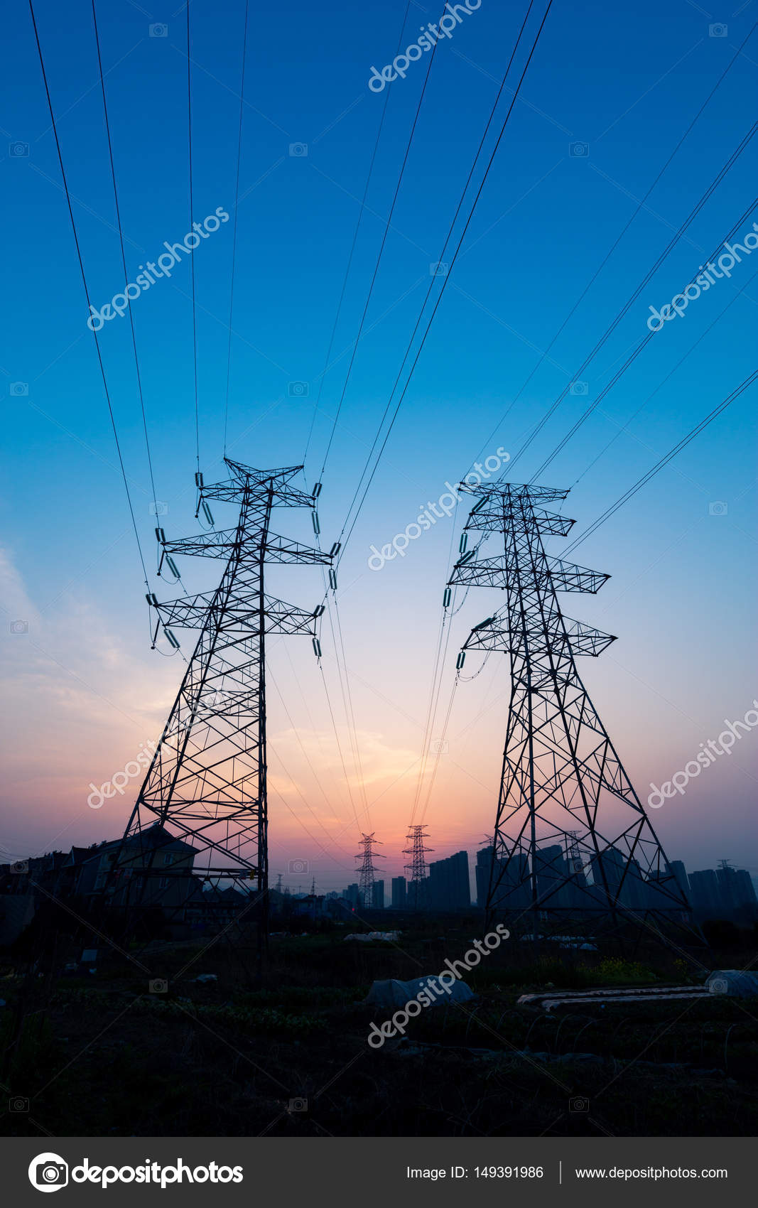 Pylons in blue sky at sunrise — Stock Photo © zhudifeng #149391986