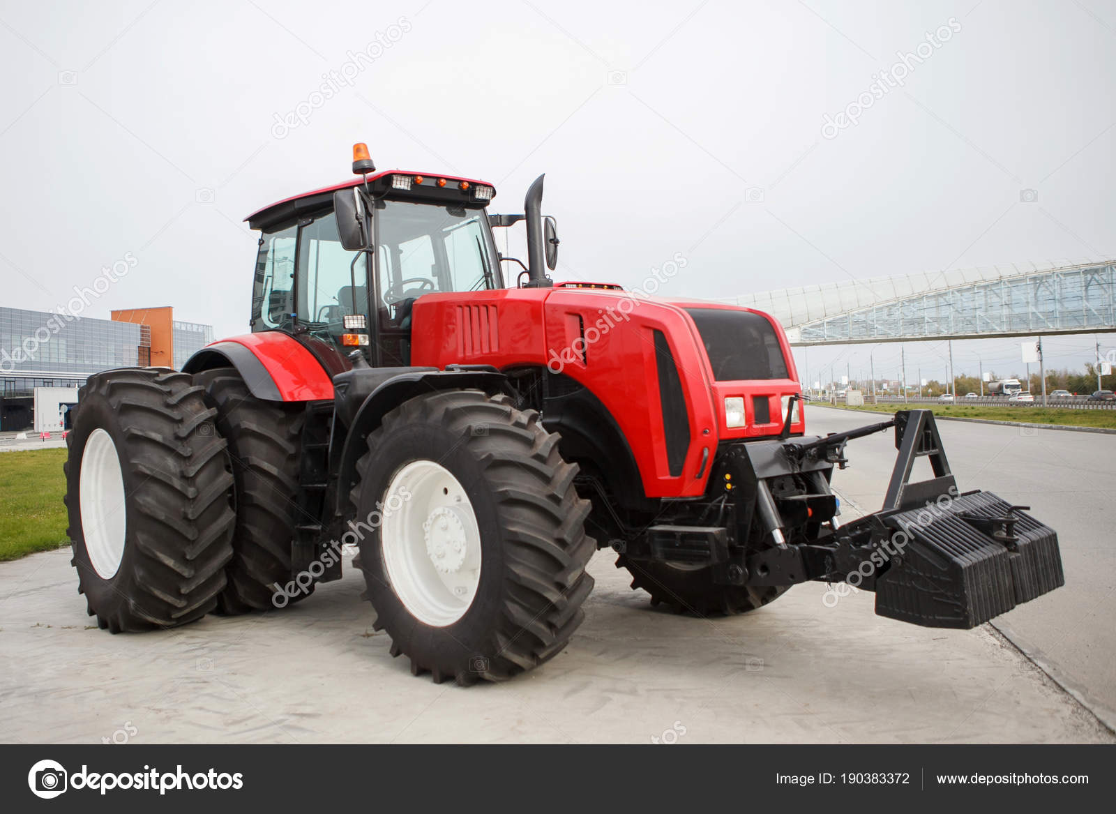 New Red modernized agricultural tractor with large wheels at the ...