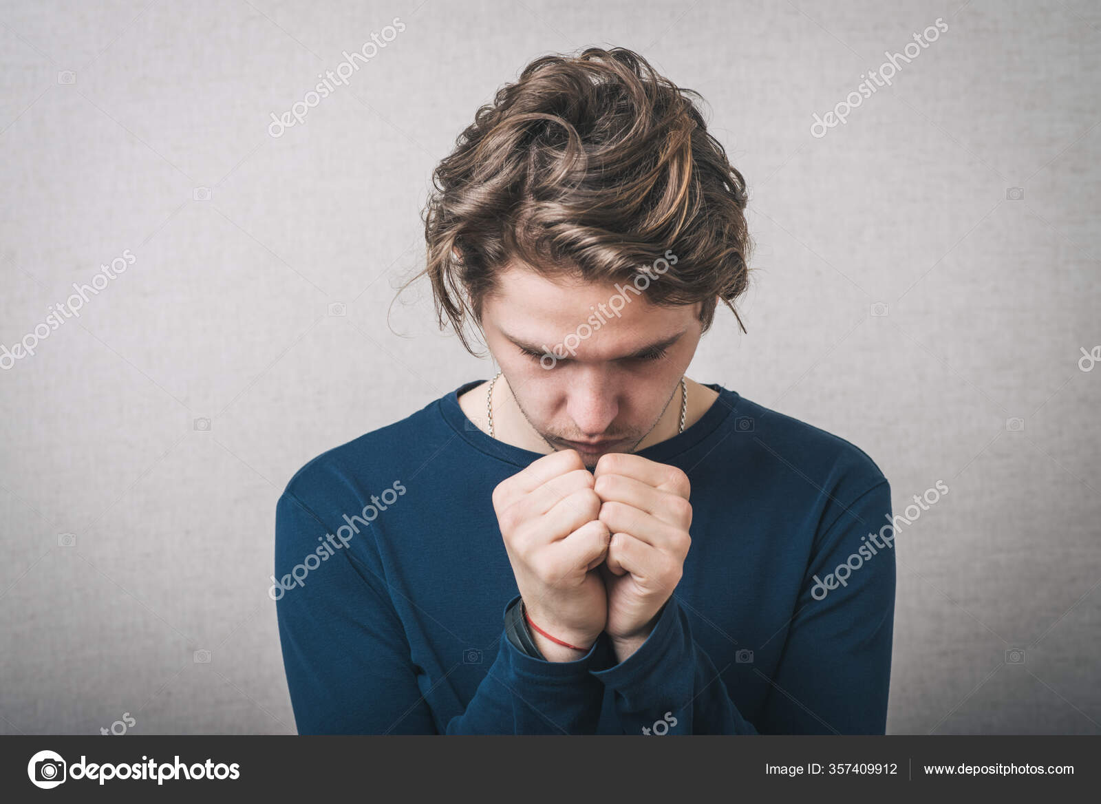 Praying Man Studio Background Stock Photo by ©file404 357409912