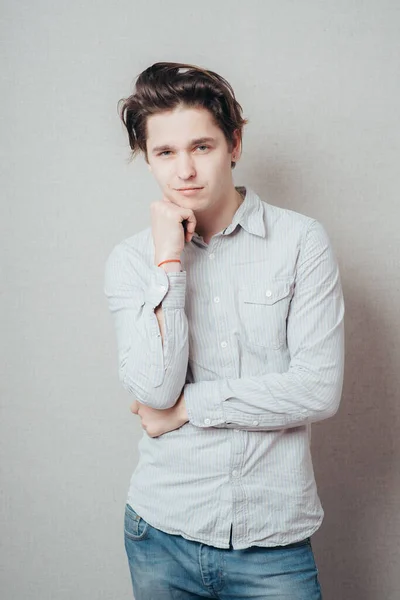 Young Man His Fist Chin — Stock Photo © file404 #357400876