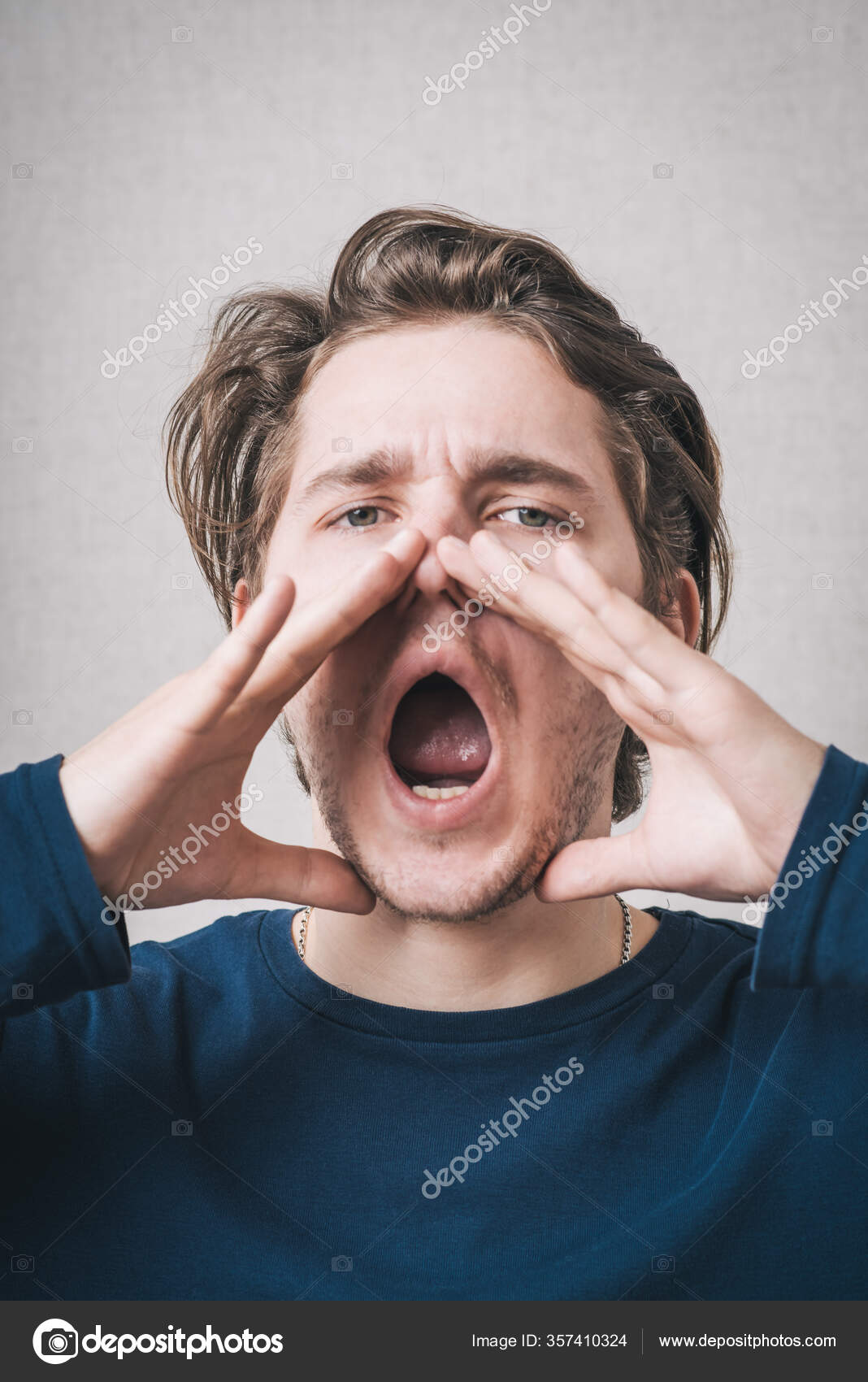 Guy Calling Someone Studio Background Stock Photo by ©file404 357410324