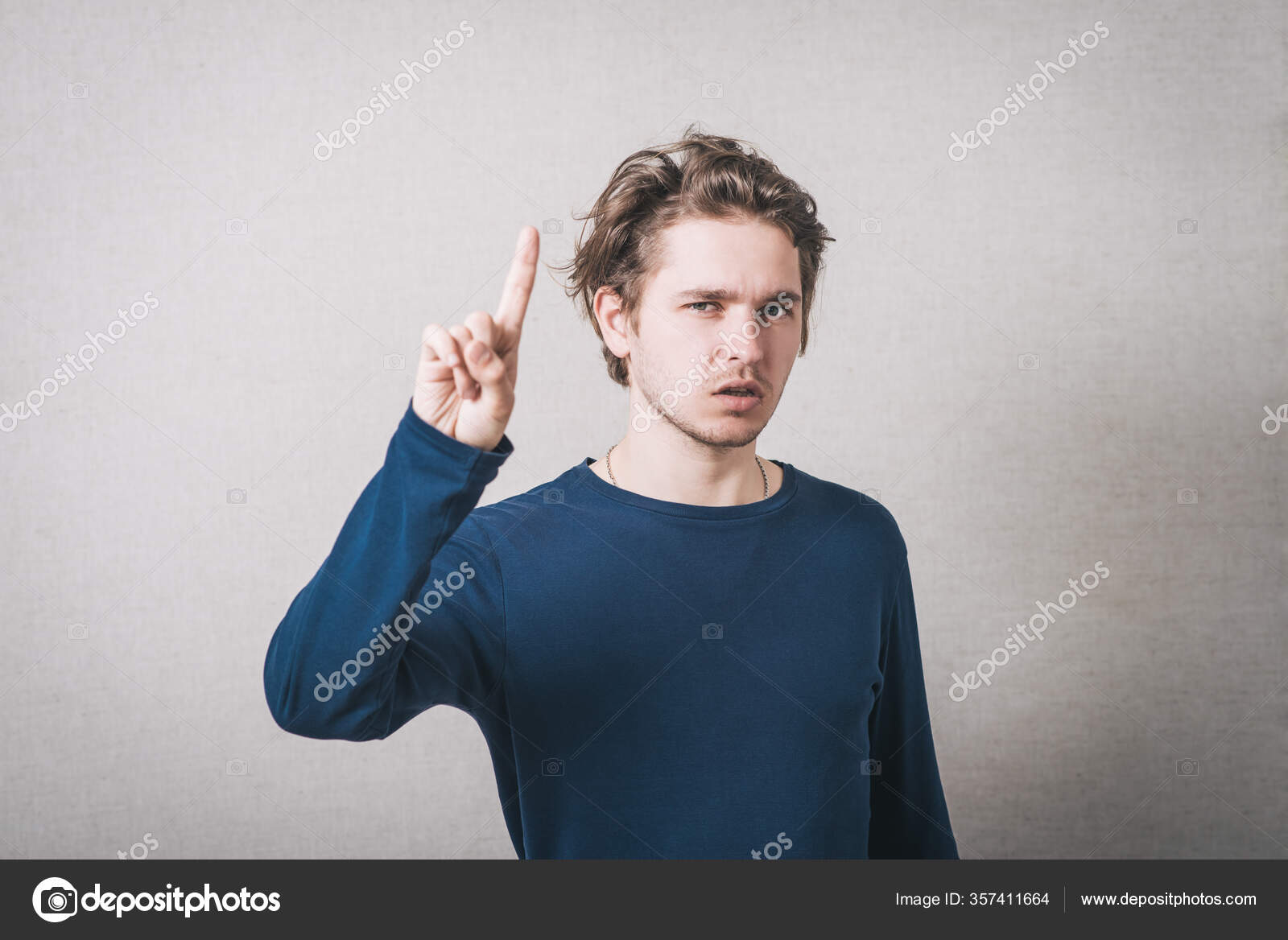 Man Showing Fingers Gray Background Stock Photo by ©file404 357411664