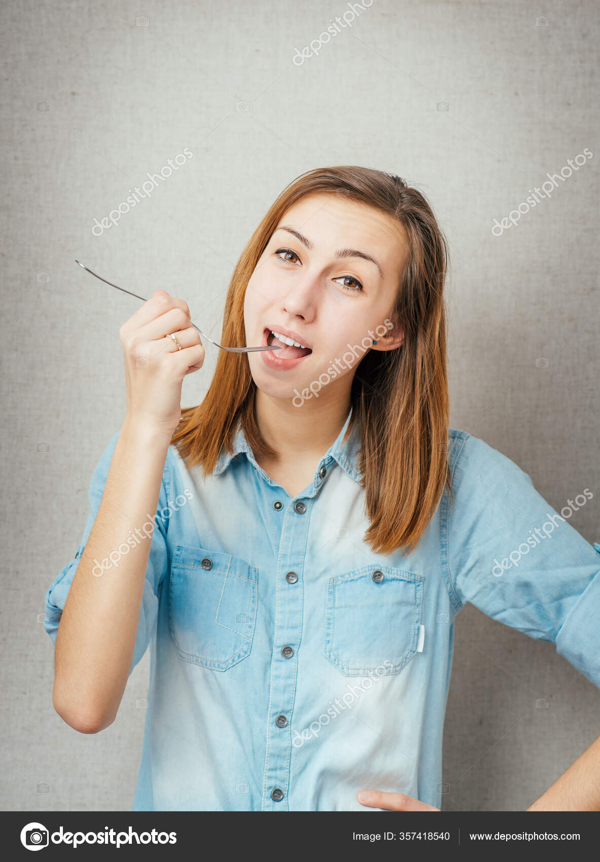 Woman Fork Eats Isolated Gray Background Stock Photo by ©file404 357418540