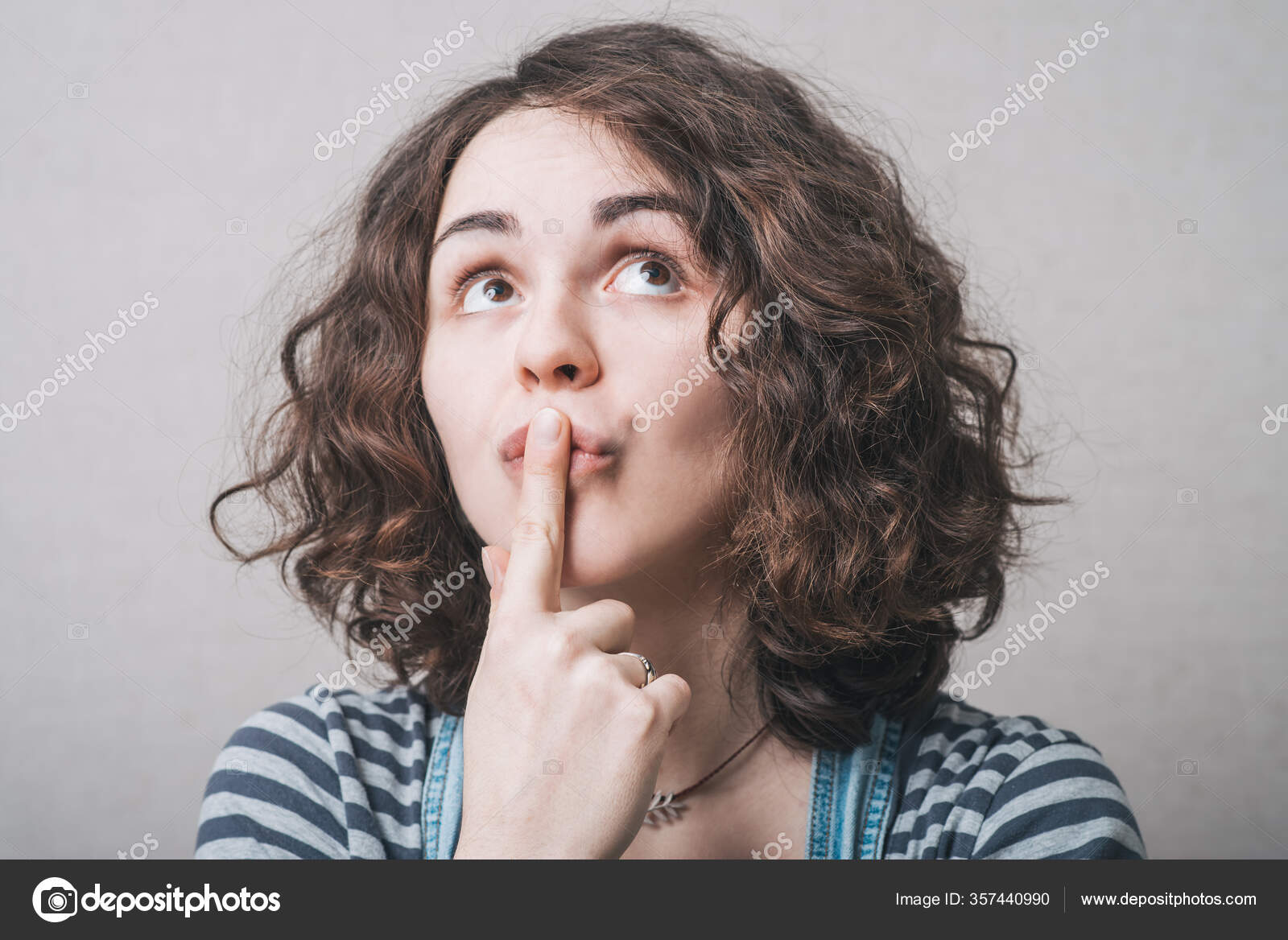 Girl Thinking Studio Background Stock Photo by ©file404 357440990