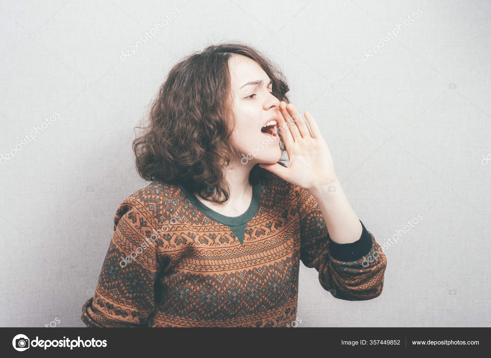 Girl Calling Someone Studio Background Stock Photo by ©file404 357449852