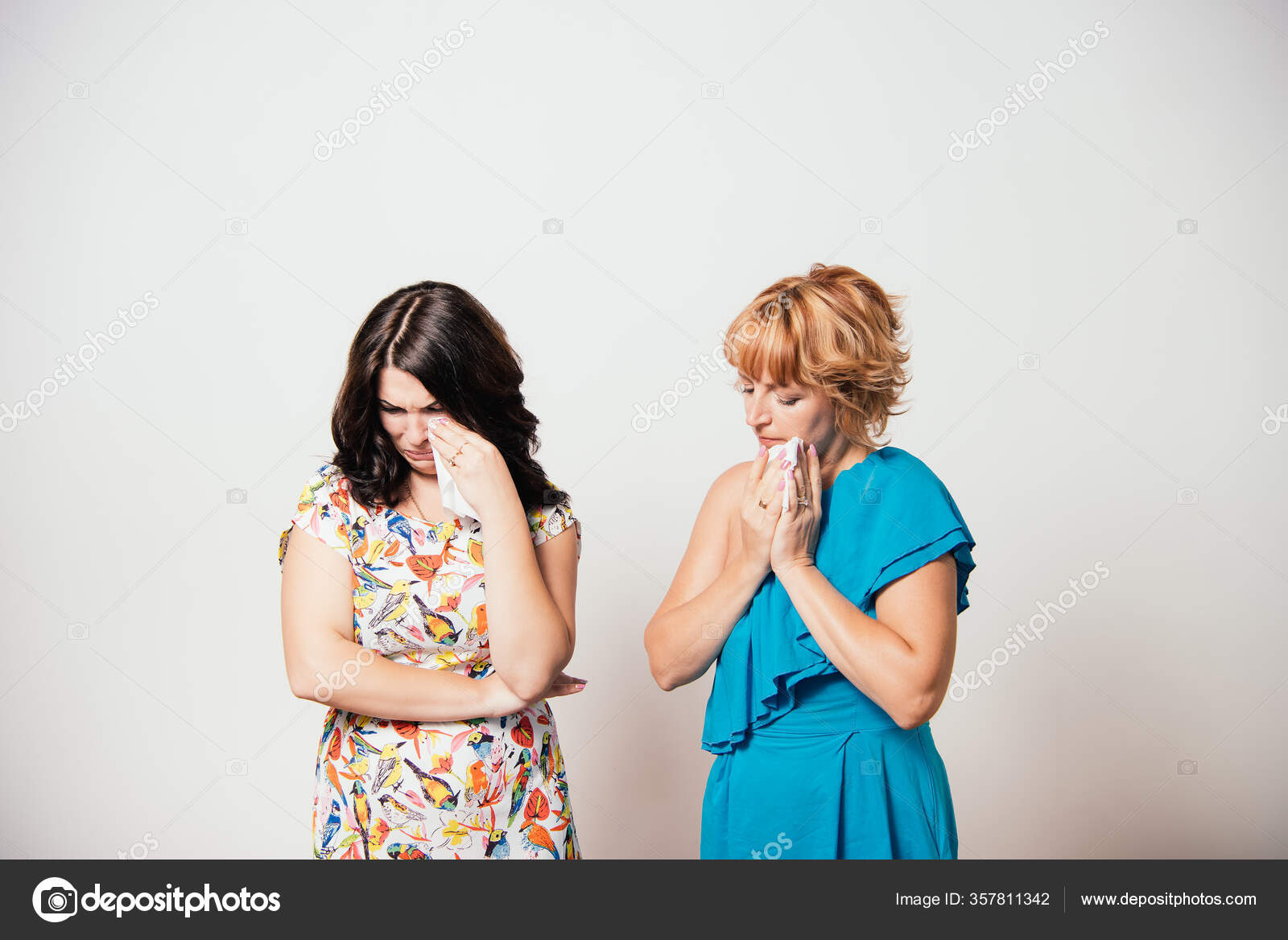 Two Women Weep Studio Background Stock Photo by ©file404 357811342