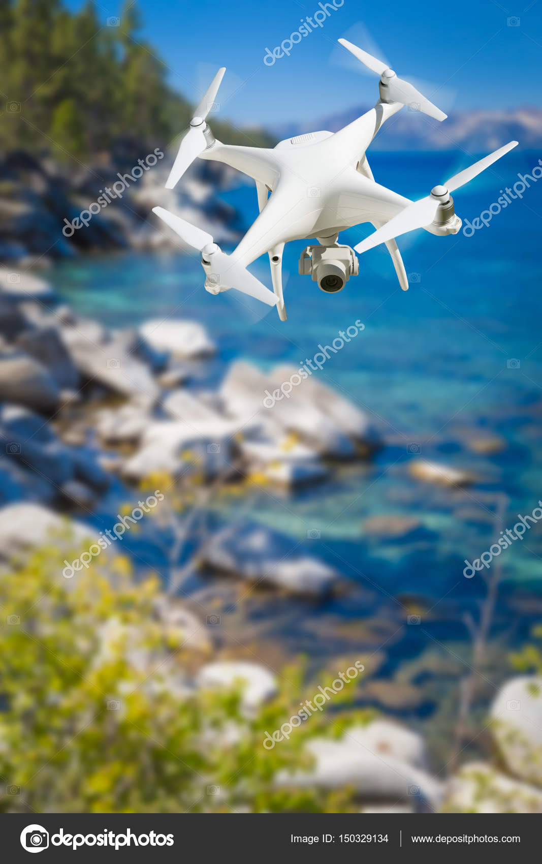 Unmanned Aircraft System (UAV) Quadcopter Drone In The Air Over Lake ...