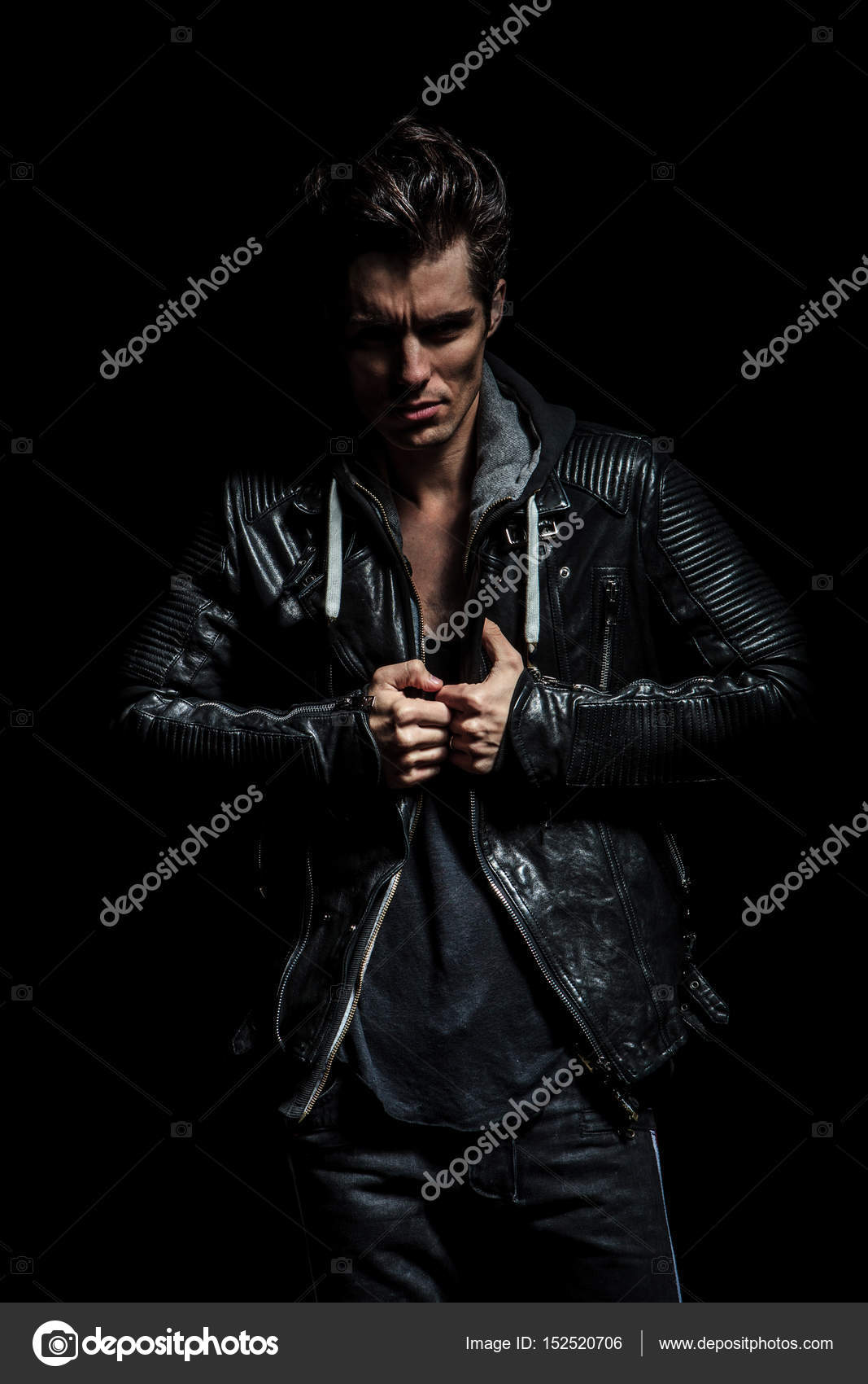 Angry man pulling his leather jacket's collar — Stock Photo © feedough ...