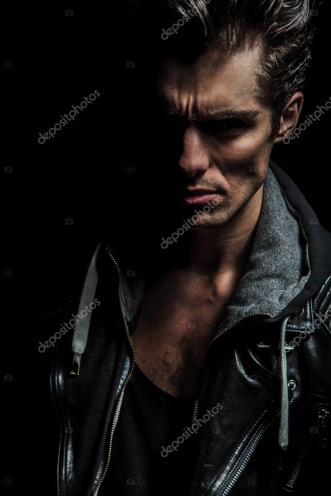 Closeup portrait of a dramatic man in leather jacket — Stock Photo ...