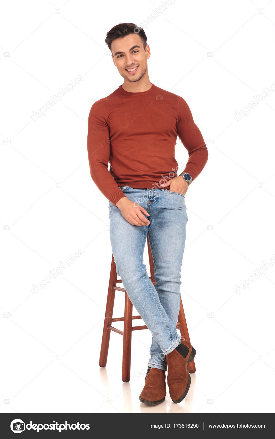 Casual man sitting on a stool and smiles Stock Photo by ©feedough 173616290