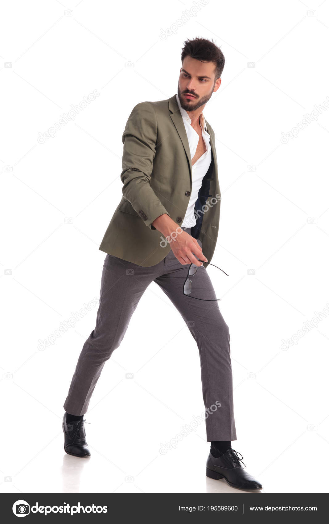 Sexy man walking with undone shirt looks to side Stock Photo by ...