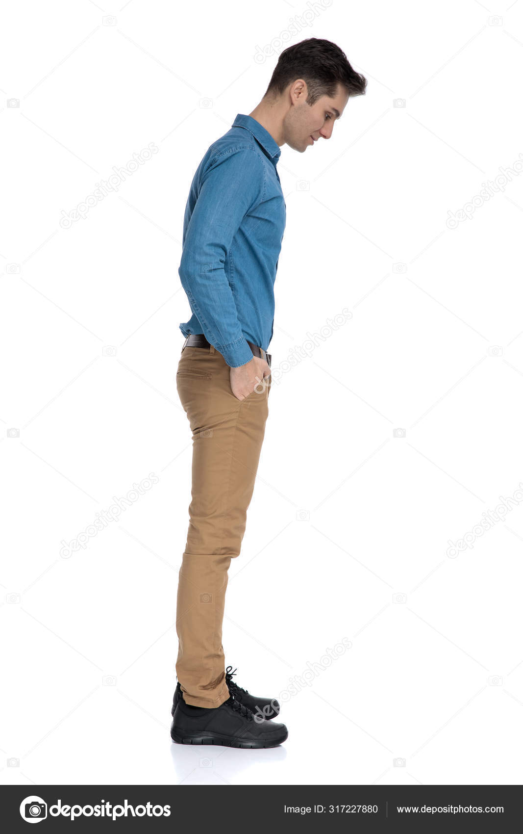 Smart casual man waiting in line and looking down Stock Photo by ...