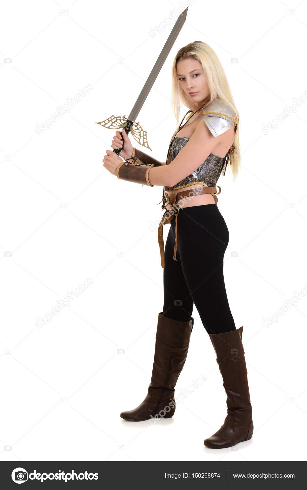 Warrior woman using two handed sword Stock Photo by ©mcgphoto 150268874