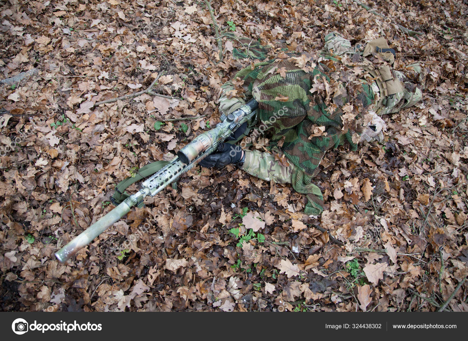 Army sniper hiding on ground in forest leaves ⬇ Stock Photo, Image by ...