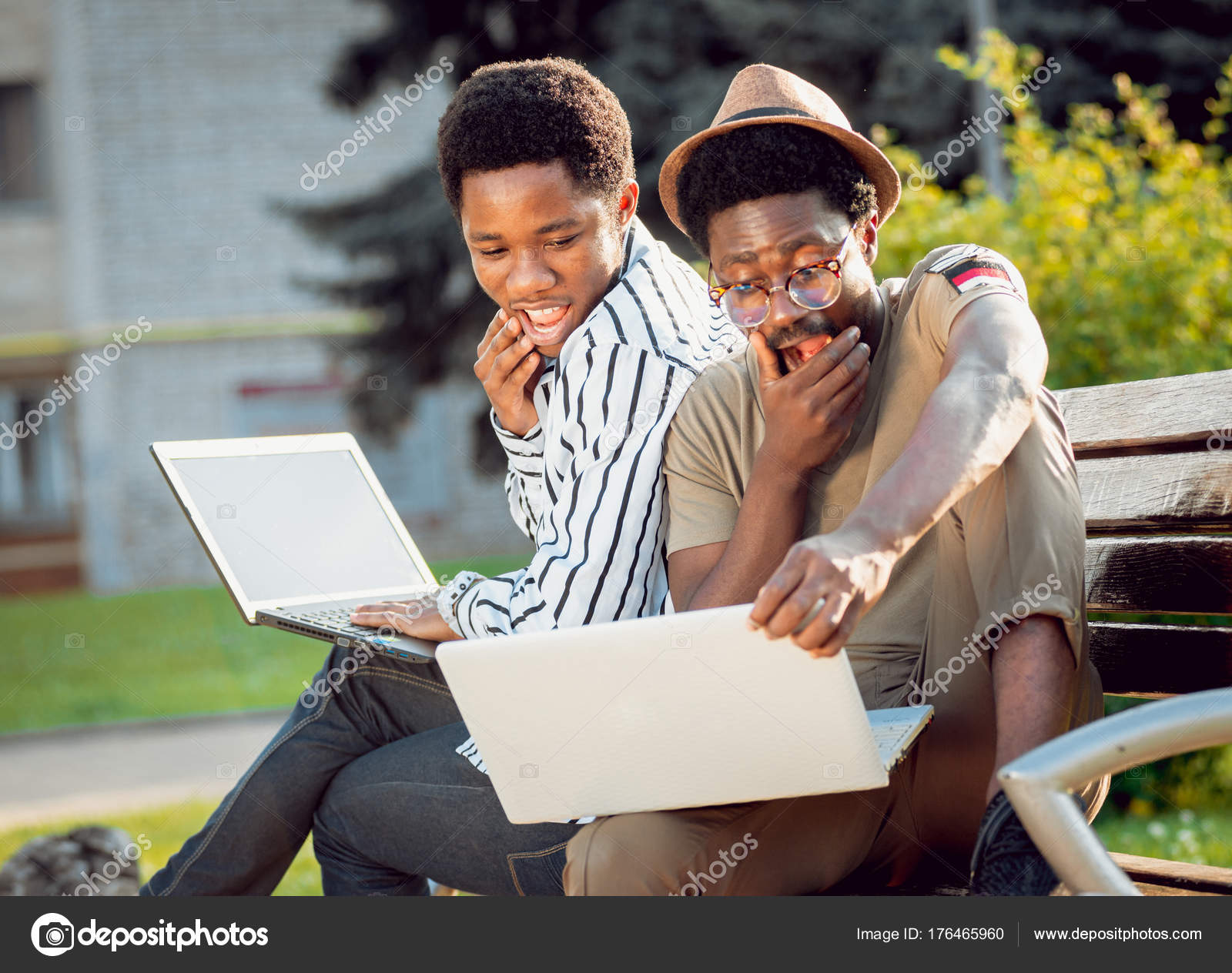 Two African Students Laptops Green Park — Stock Photo © Romaset #176465960