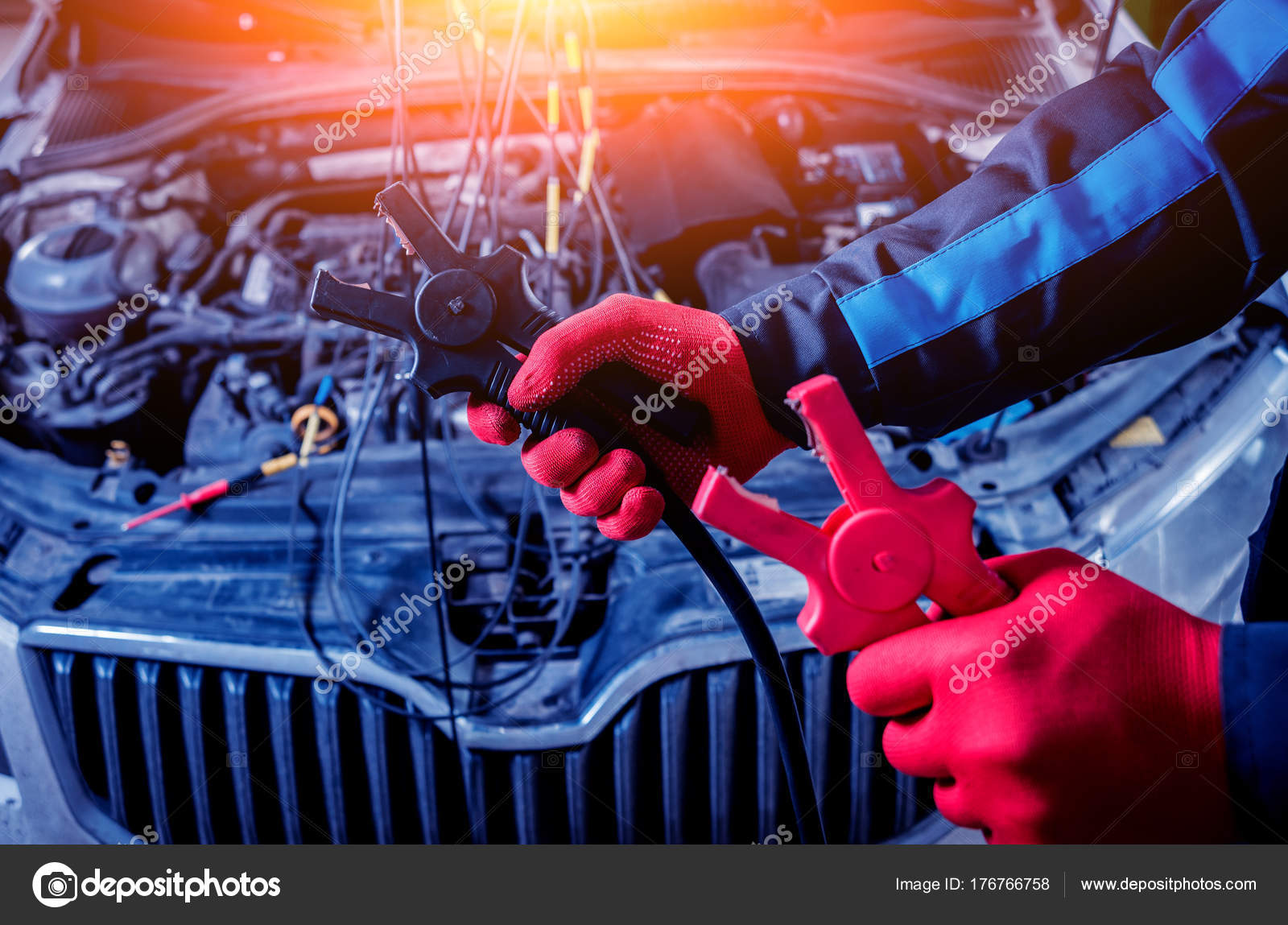 Accumulator charging. Hands and terminals. Car repair. Stock Photo by ...