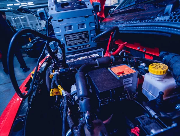 Electic car with open hood. Details of electric car engine. Battery ...