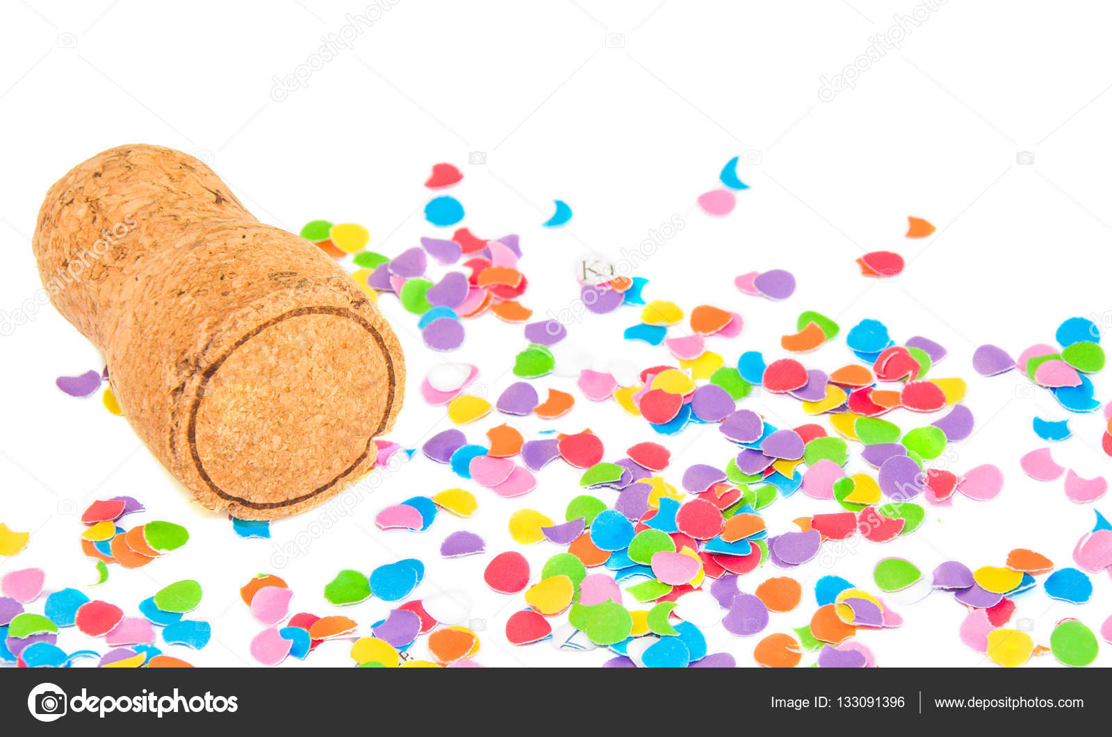 Champagne cork on confetti background. Stock Photo by ©luckylia 133091396