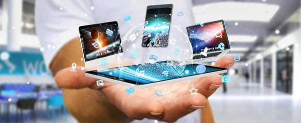 Businessman connecting tech devices to each other 3D rendering — Stock ...