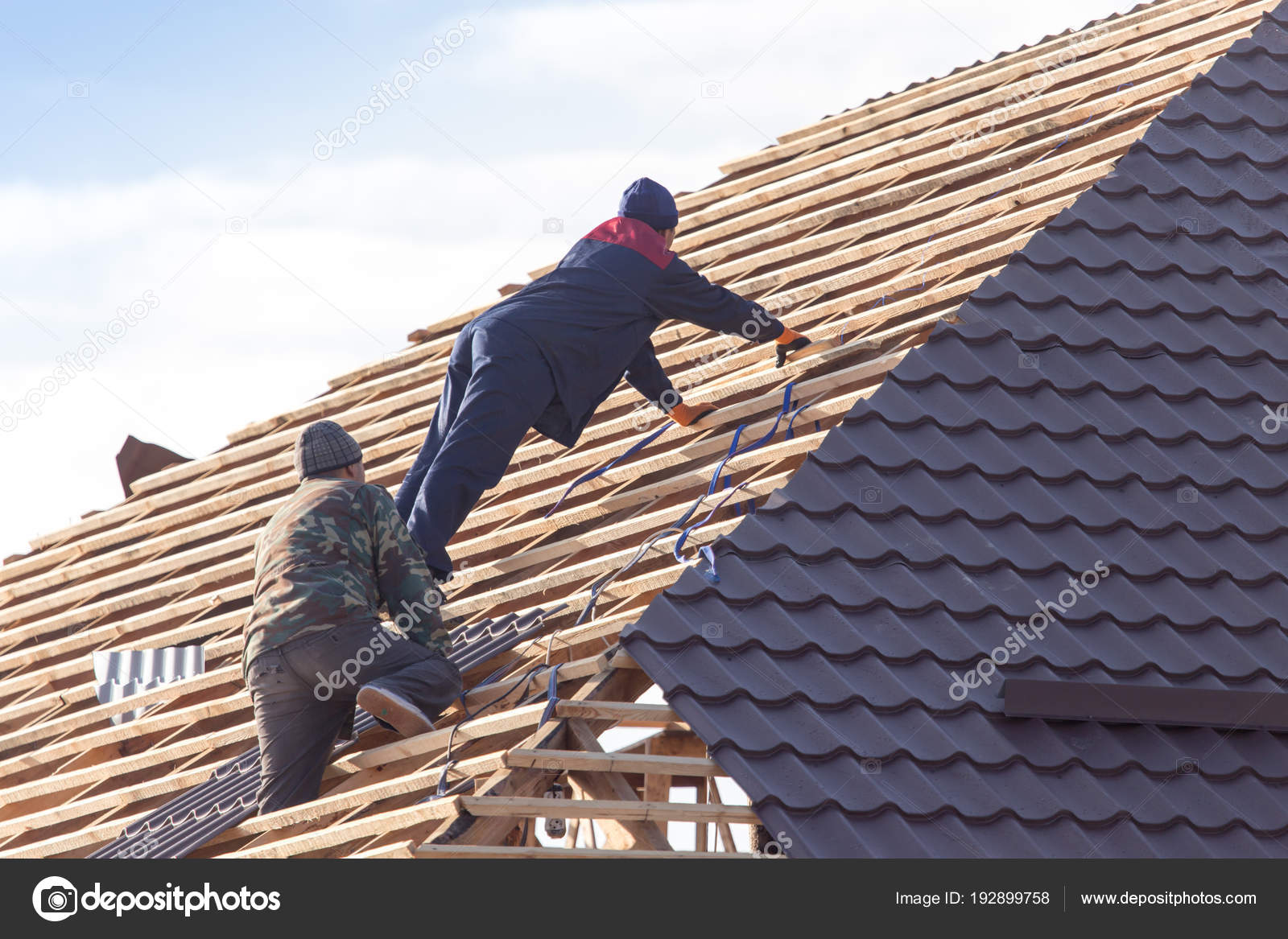 Workers working on the roof Stock Photo by ©schankz 192899758