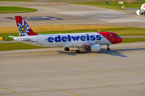 Edelweiss airlines airplane preparing for landing at day time in ...