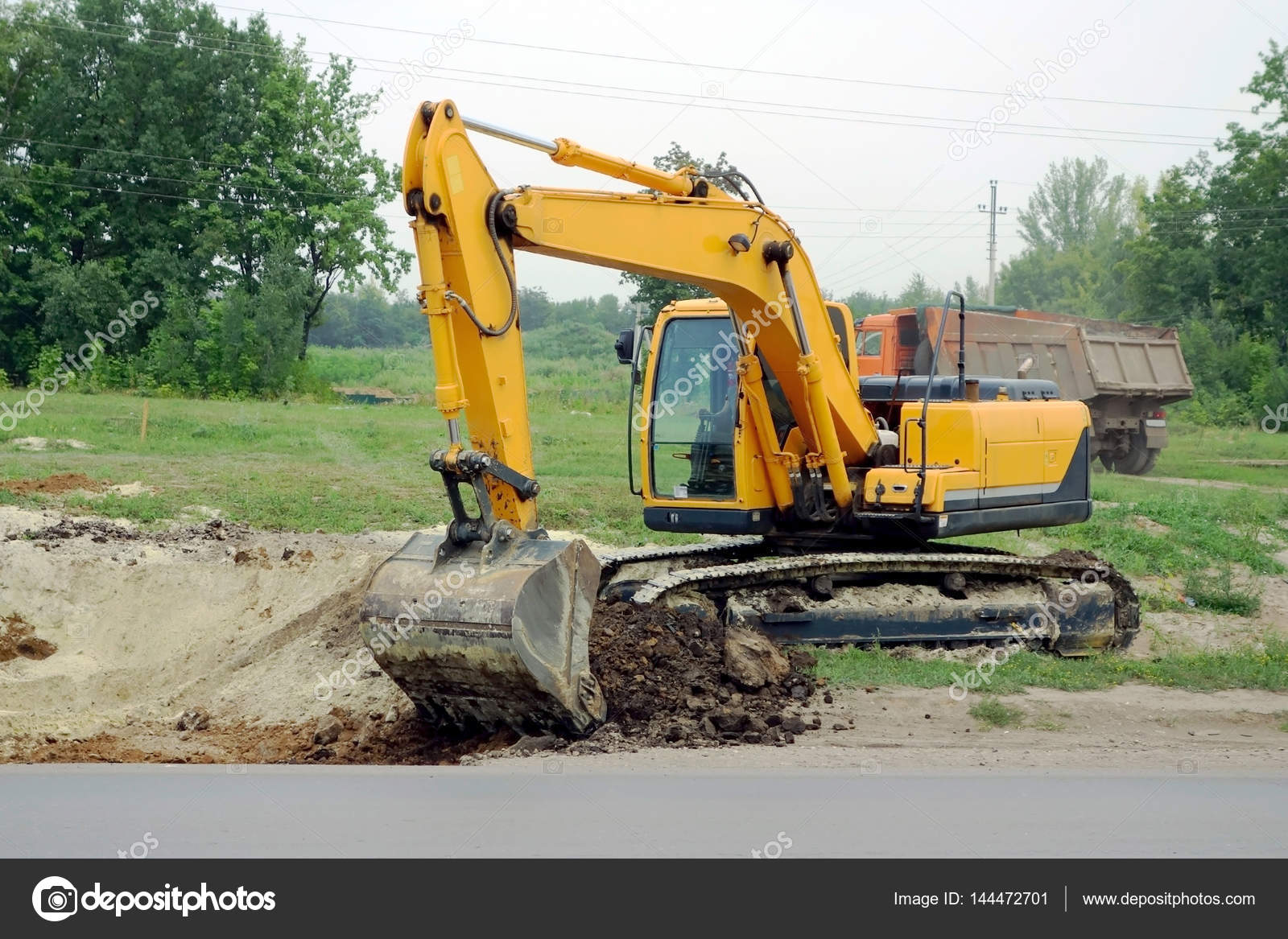 Yellow excavator digging — Stock Photo © ra3rn_ #144472701