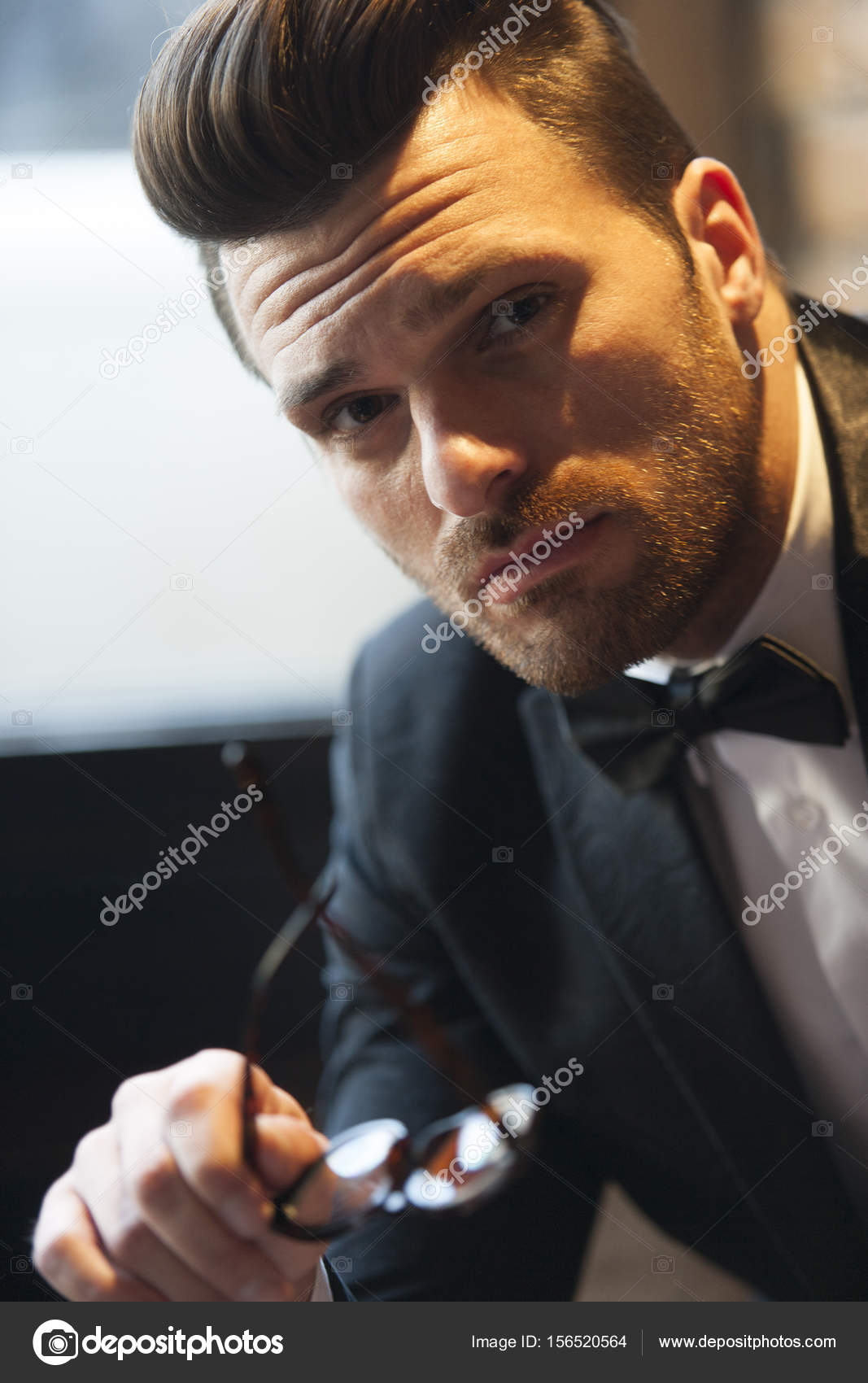 Handsome man portrait with bow tie and tuxedo suit — Stock Photo ...