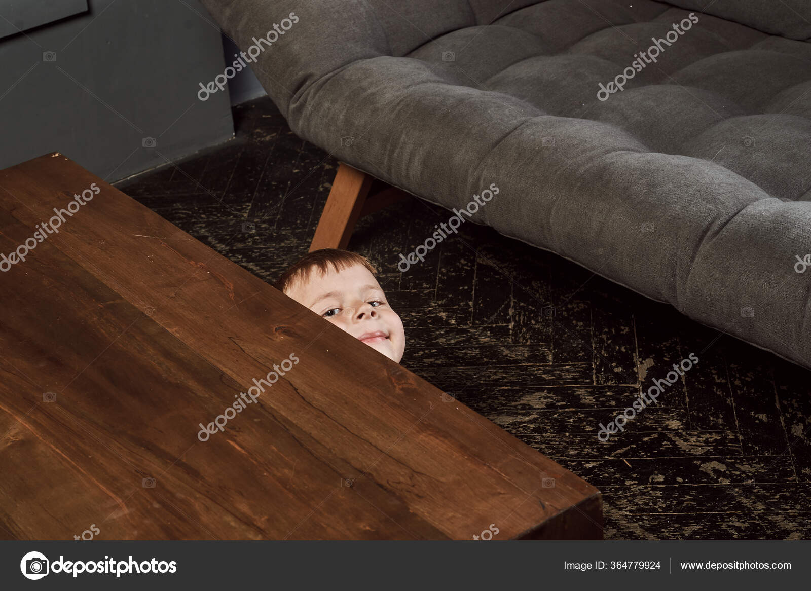 Little Boy Looks Out Table — Stock Photo © Nebasin #364779924