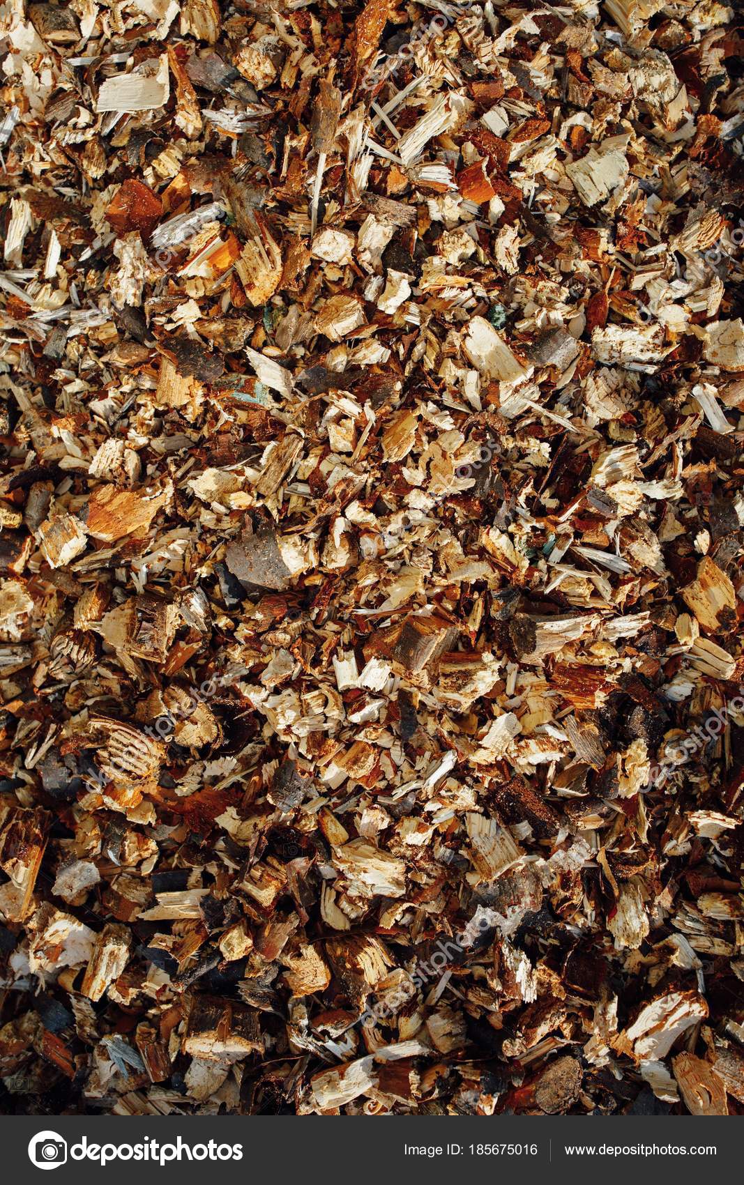 Wooden mulch background, closeup view Stock Photo by ©nikkytok 185675016