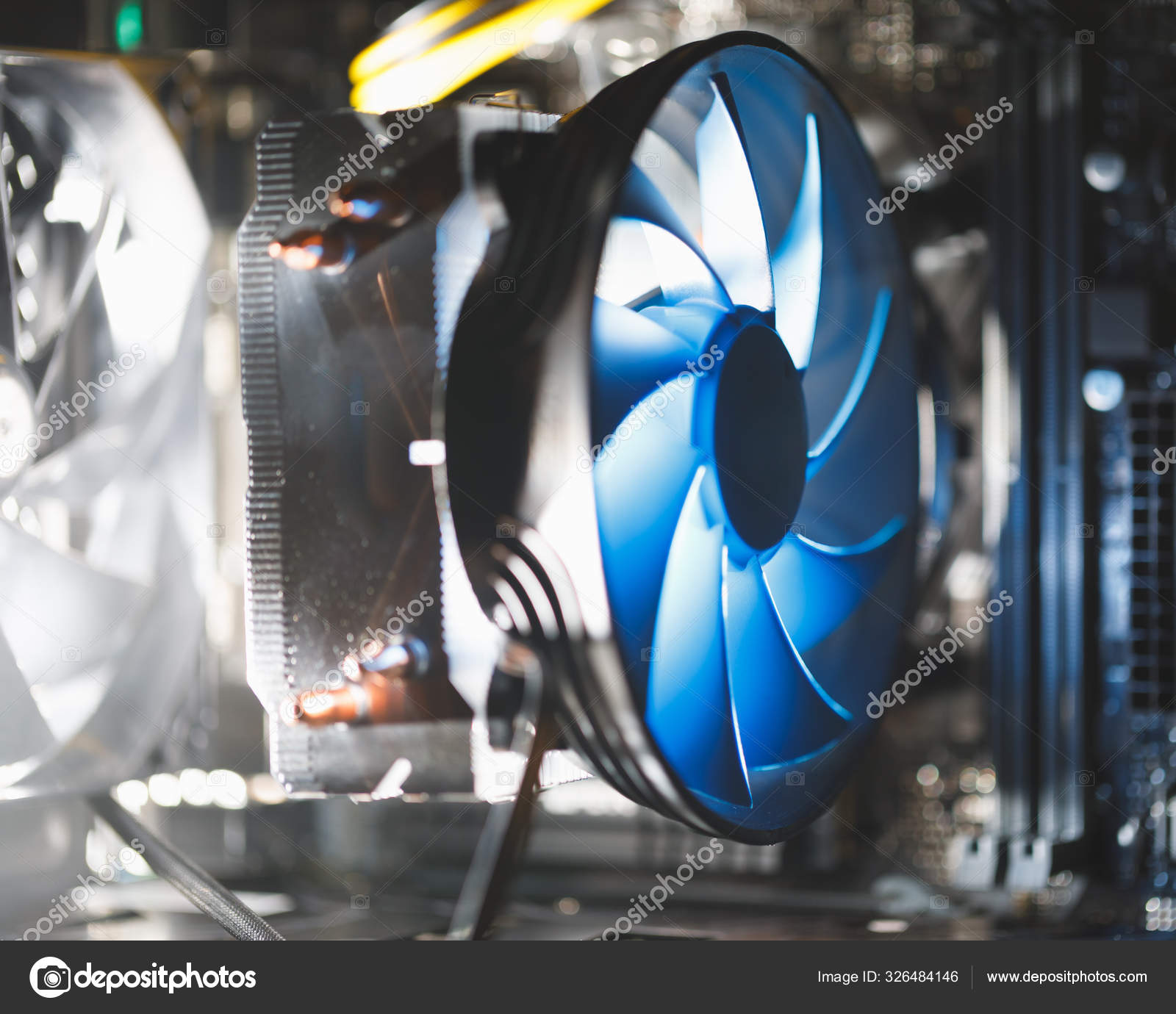 Blue cpu cooler inside PC case, shiny light background Stock Photo by ...