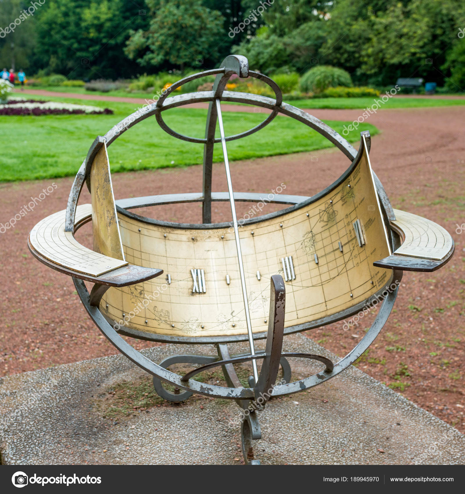 Sundial. old sun clock dial in a garden Stock Photo by ©ewastudio 189945970