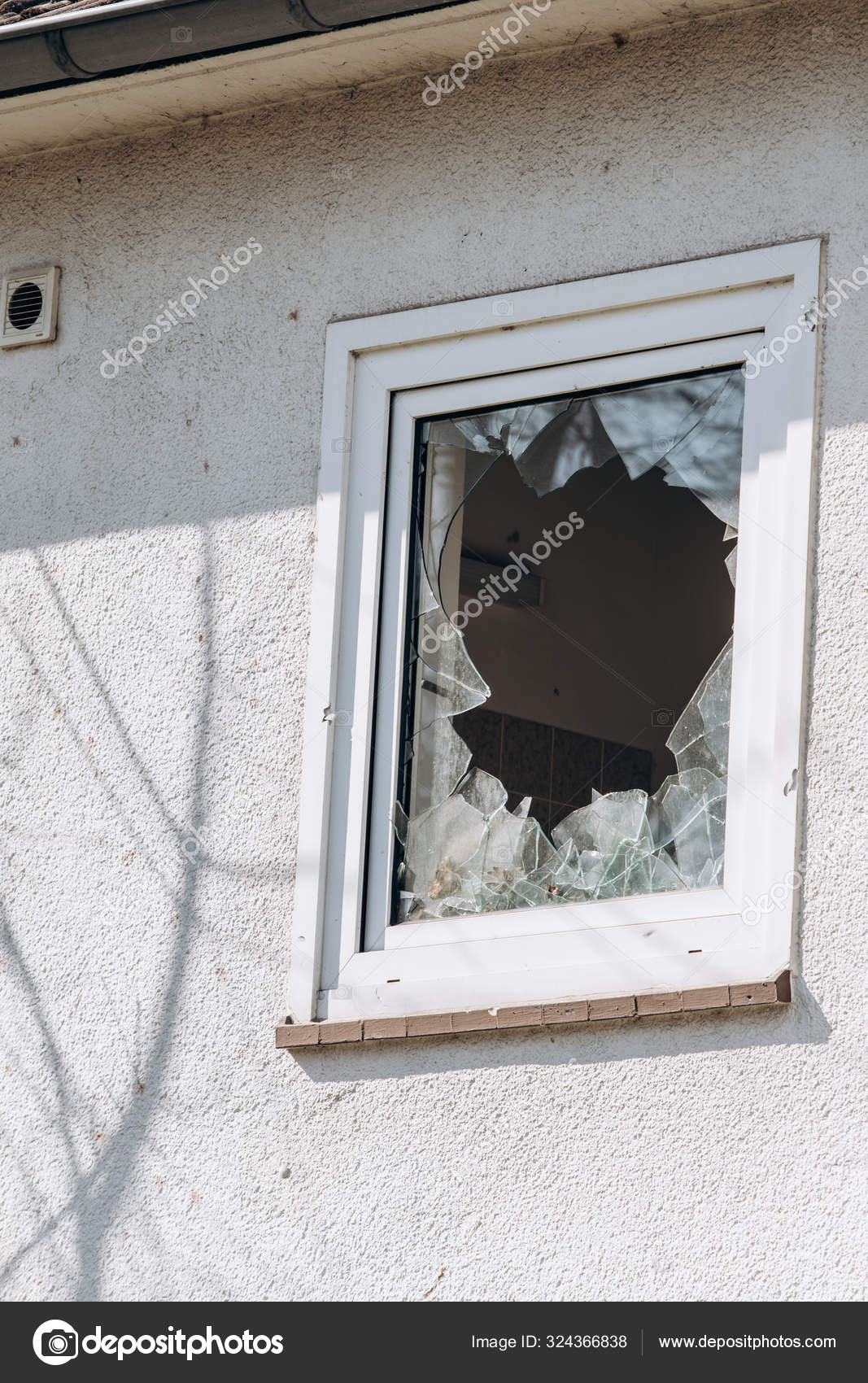 Broken Windows in the house. Shards of glass remained in the window ...