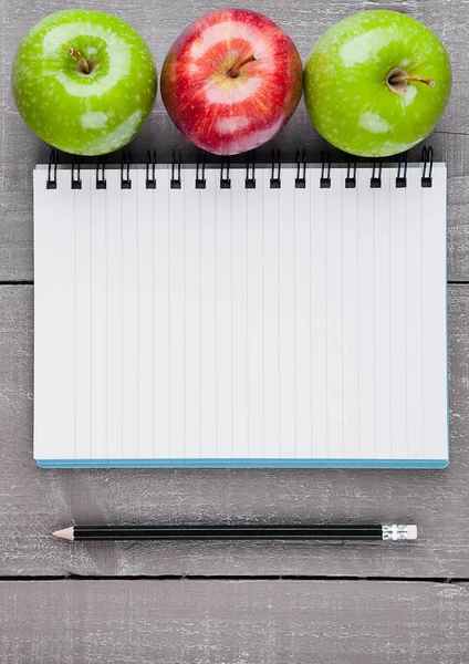 Writing pad with healthy apples as diet plan idea - Stock Image ...