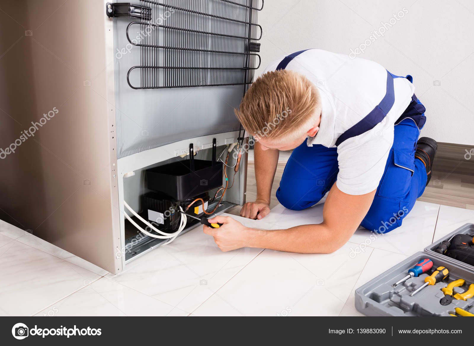 Male Technician Checking Refrigerator Stock Photo by ©AndreyPopov 139883090