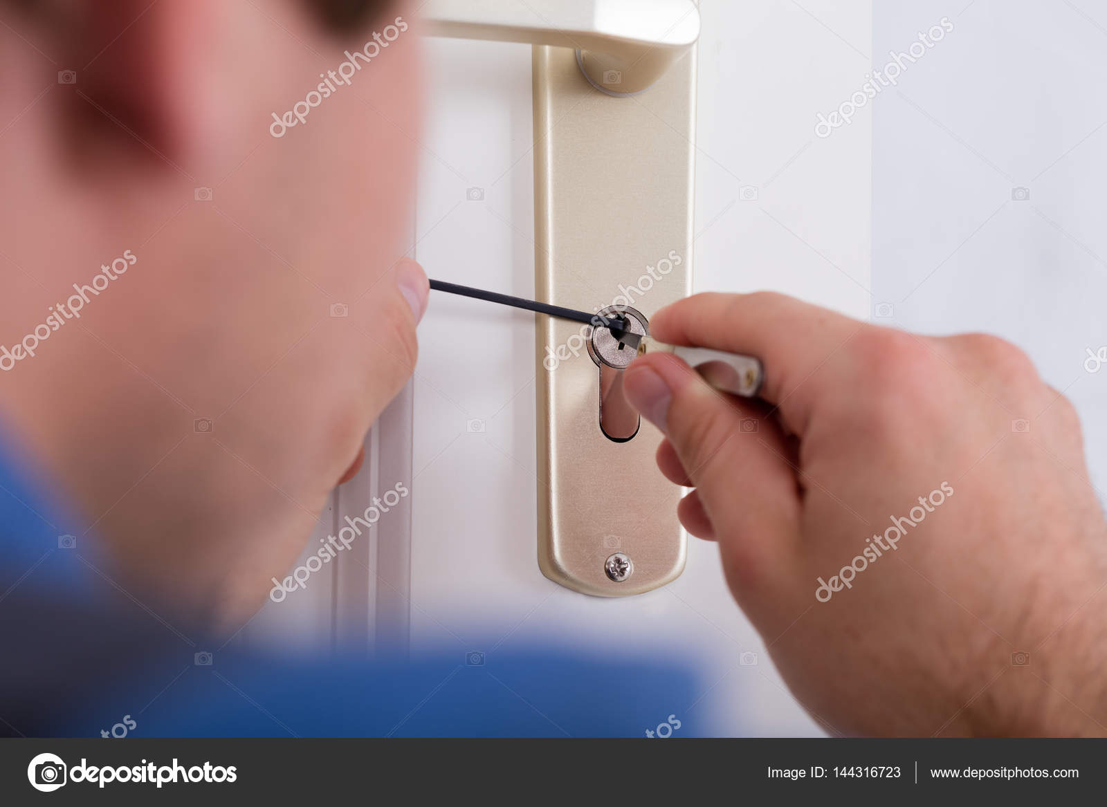 Lockpicker Fixing Door Handle Stock Photo by ©AndreyPopov 144316723