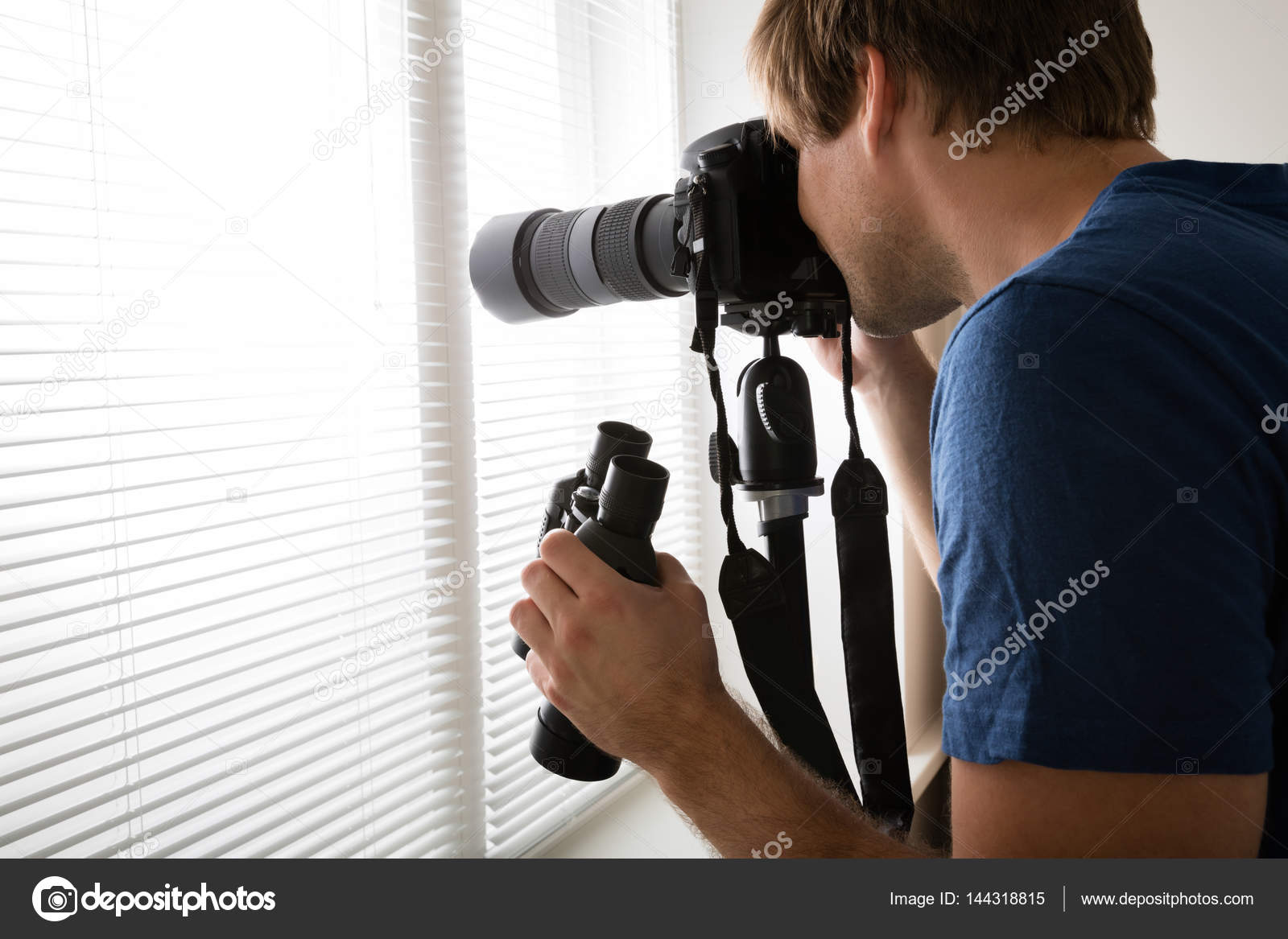 Male Holding Camera — Stock Photo © AndreyPopov #144318815