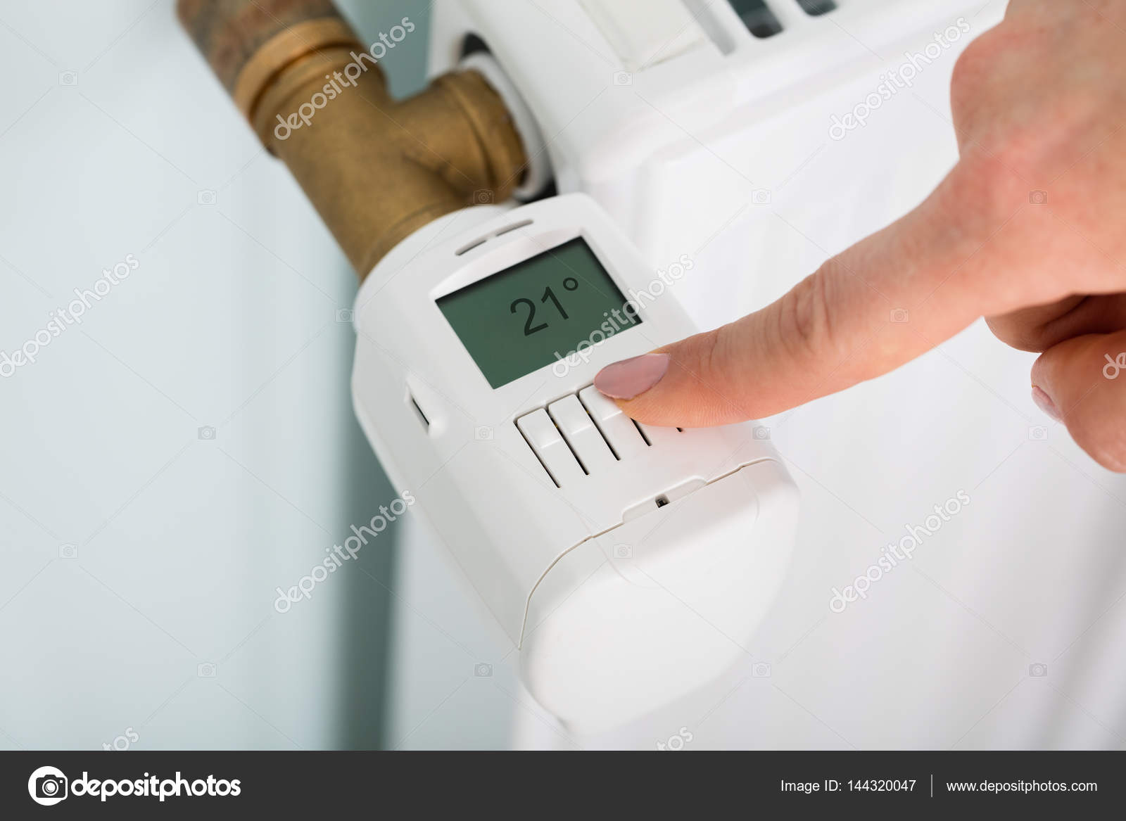 Person Adjusting Temperature Stock Photo by ©AndreyPopov 144320047