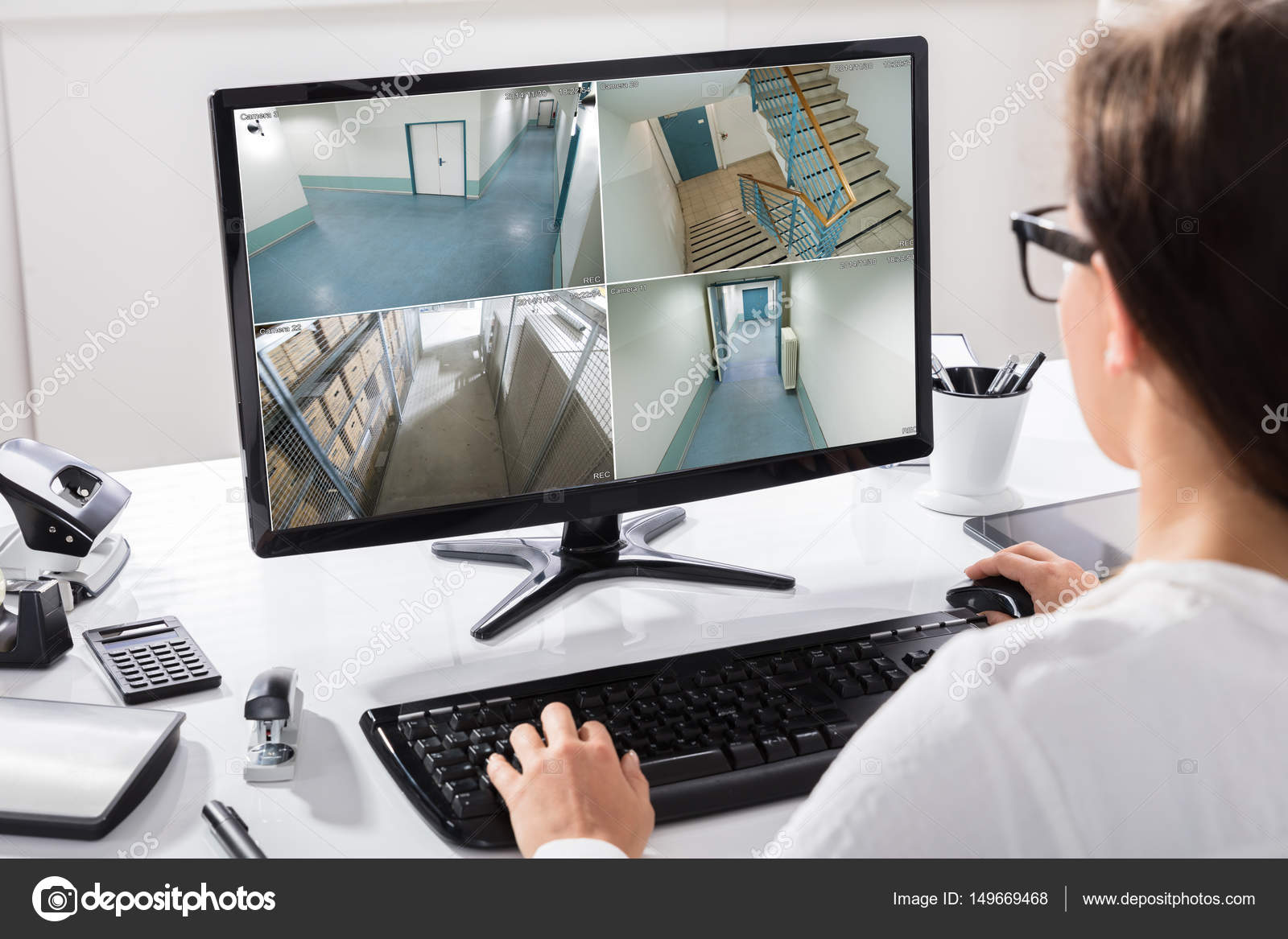 Businesswoman Watching CCTV — Stock Photo © AndreyPopov #149669468