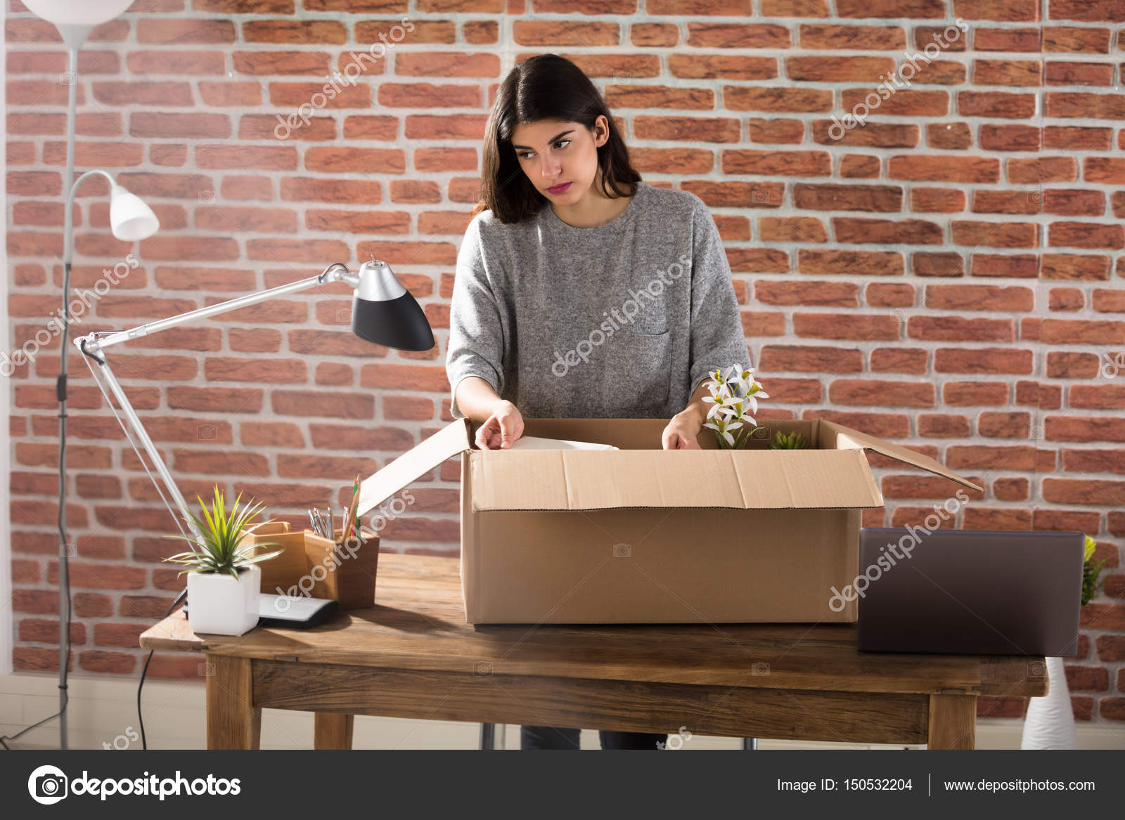 Young Employee Packing Box — Stock Photo © AndreyPopov #150532204