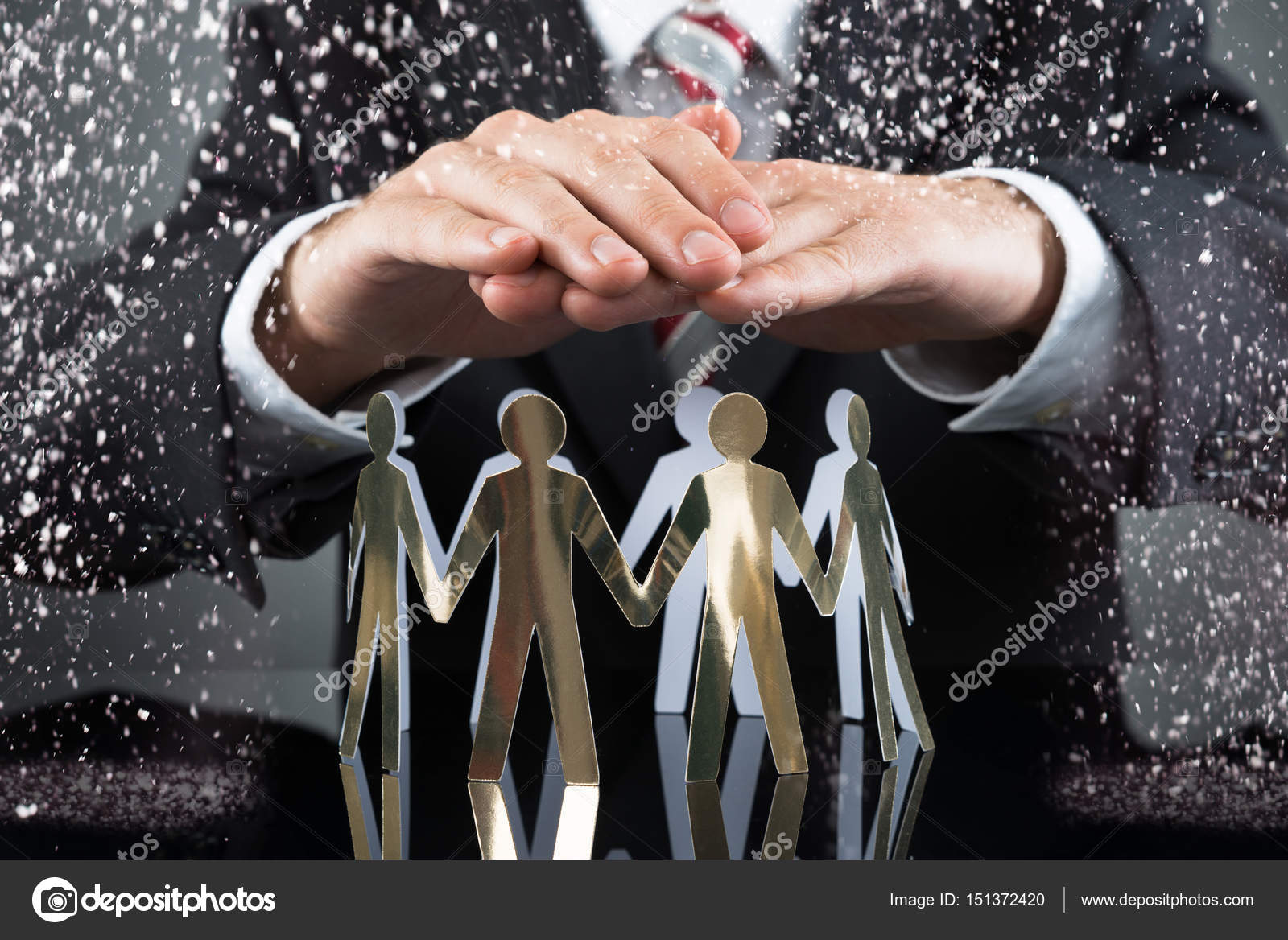 Businessman Protecting Human Figures — Stock Photo © AndreyPopov #151372420