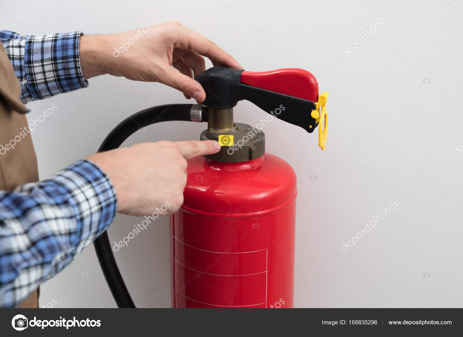 Hand Pointing To Fire Extinguisher Stock Photo by ©AndreyPopov 168835296