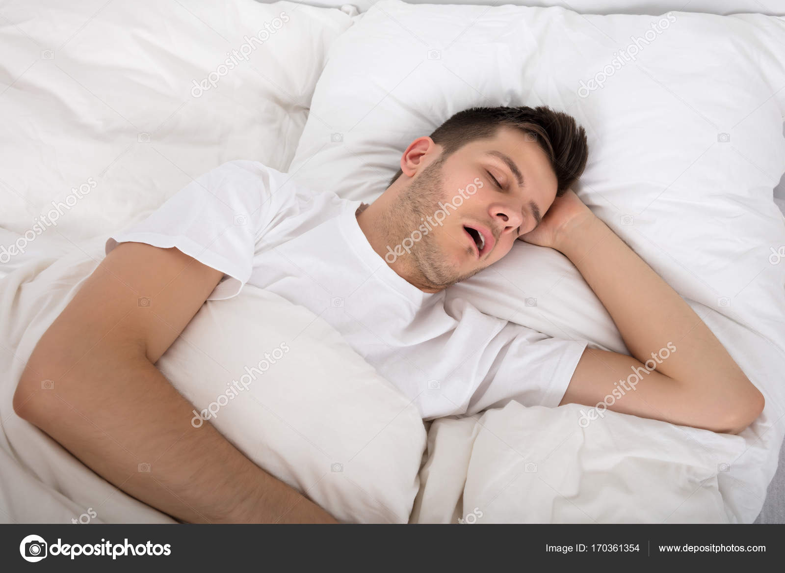 Tired Young Man Snoring — Stock Photo © AndreyPopov #170361354 Tired Young Man Snoring — Stock Photo © AndreyPopov #170361354
