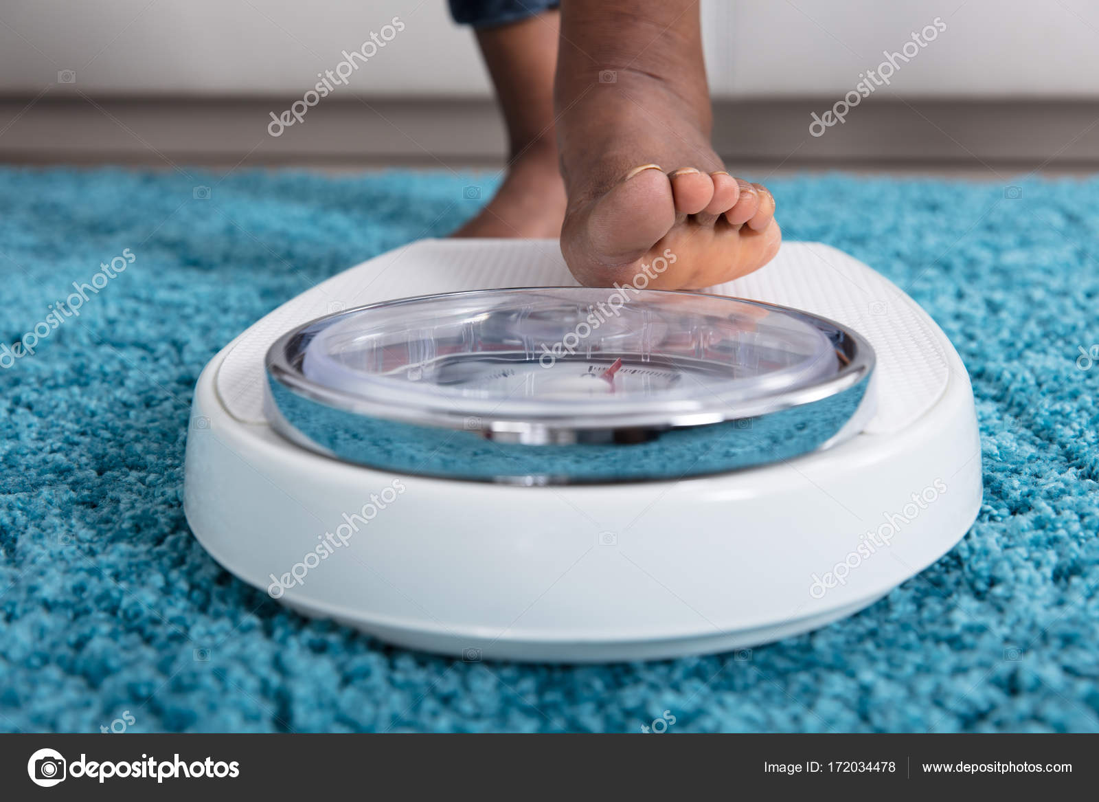 Human Stepping On Scale Stock Photo by ©AndreyPopov 172034478