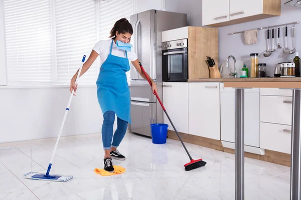 Female Janitor Mopping Floor In Office — Stock Photo © AndreyPopov ...