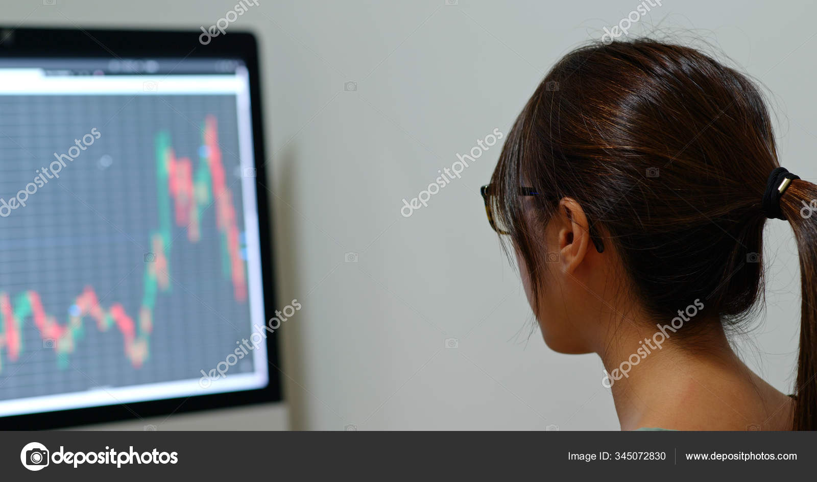 Woman look at the stock market graph at office — Stock Photo ...
