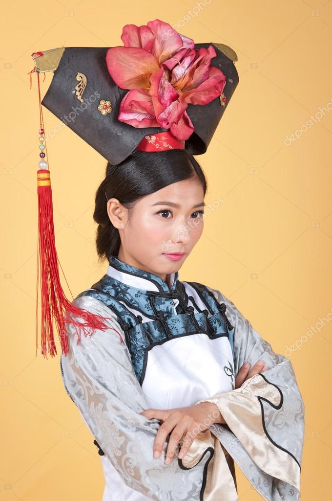 Beautiful Chinese princess with arms folded Stock Photo by ...