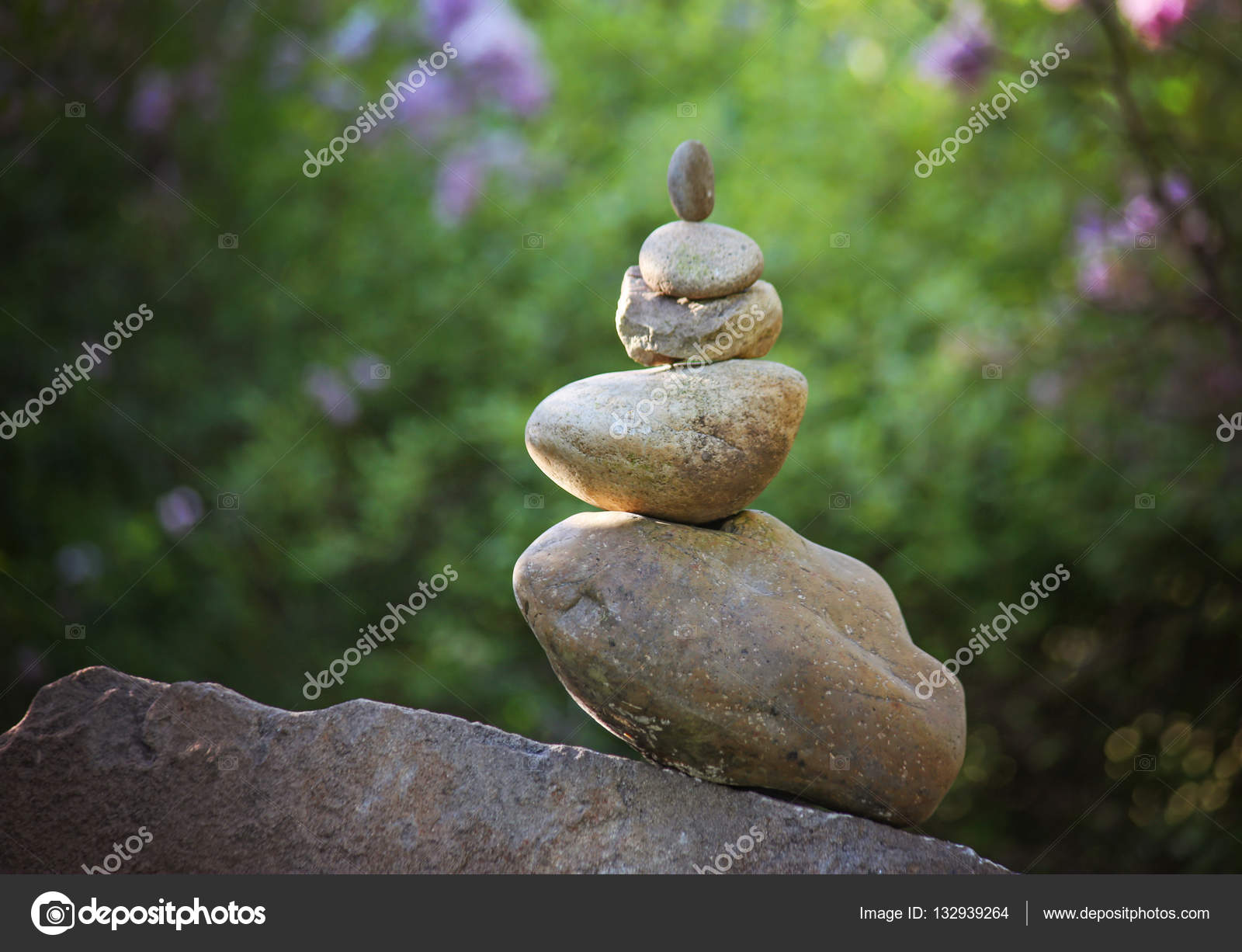 Rocks stacked up in a park at sunset Stock Photo by ©graphicphoto 132939264