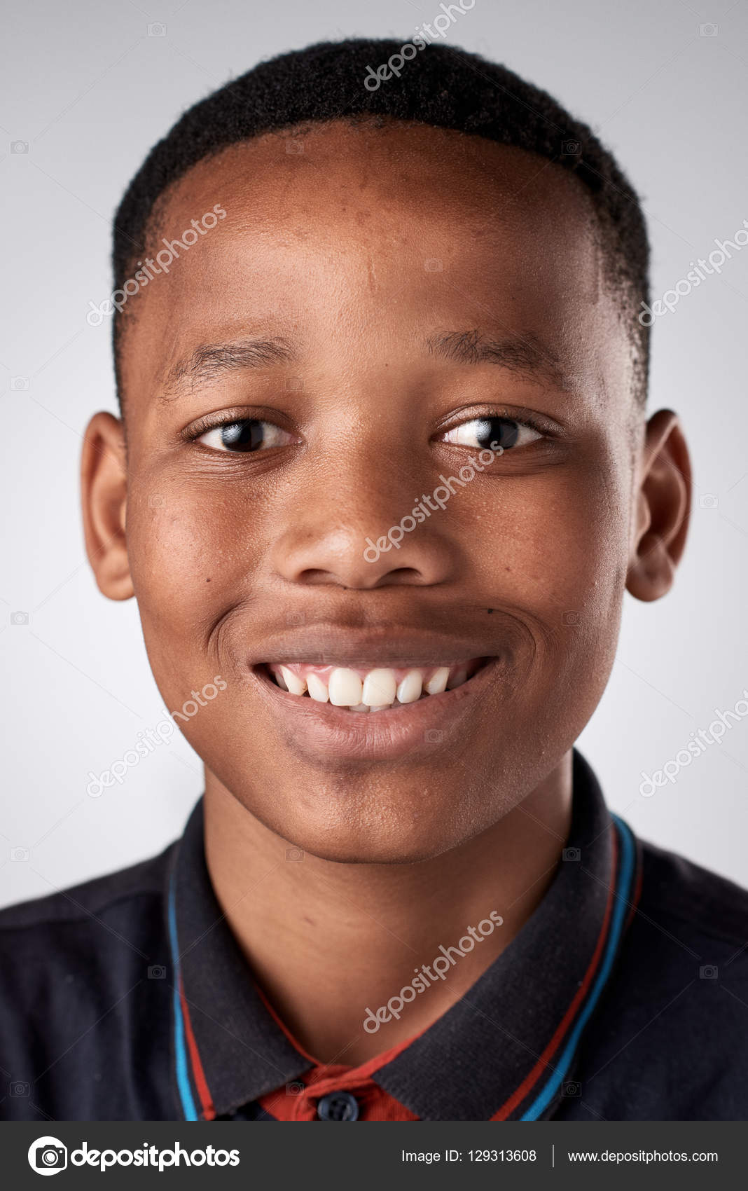 Happy African boy Stock Photo by ©Daxiao_Productions 129313608